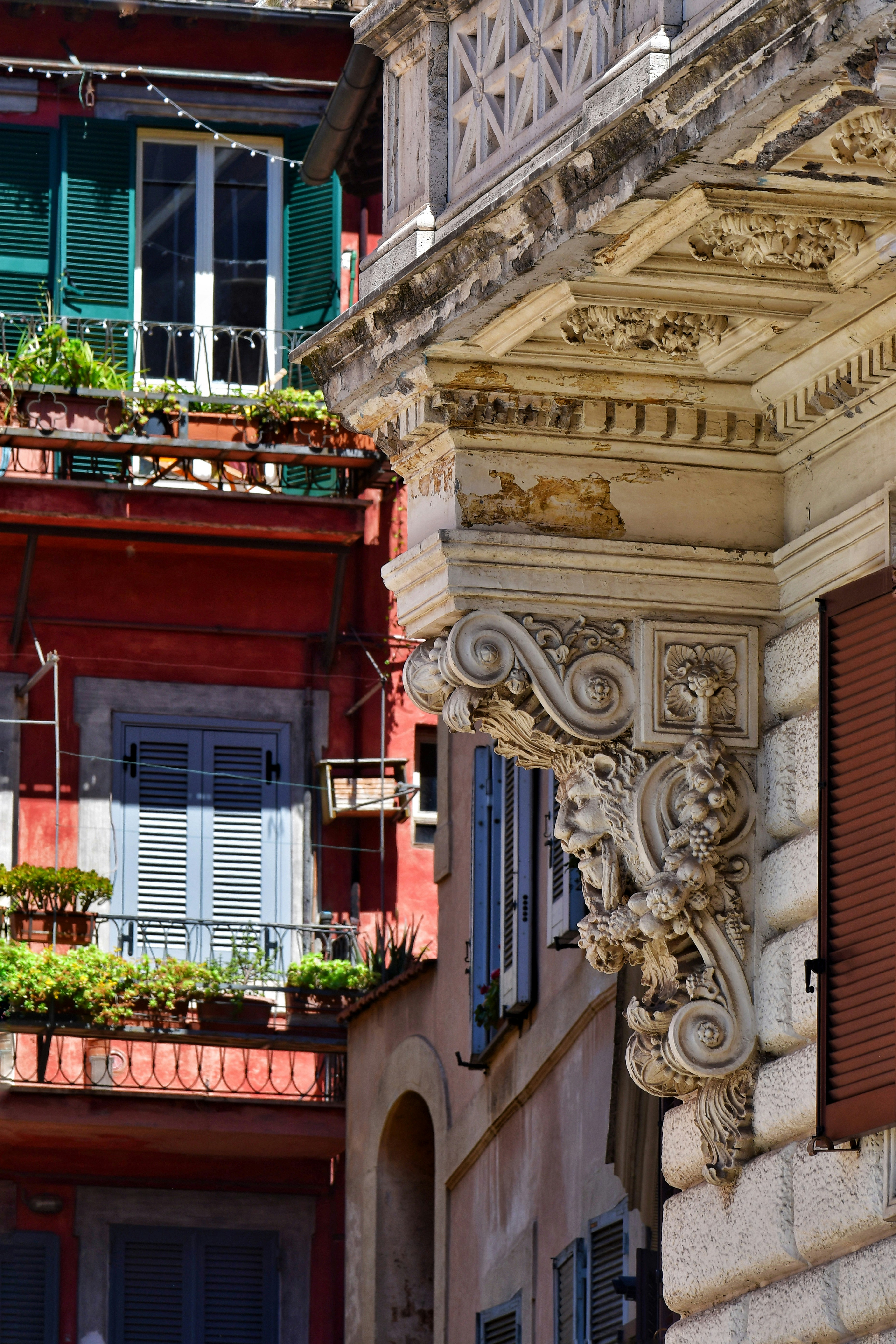 Carved architectural flourish frames a sunlit European balcony scene