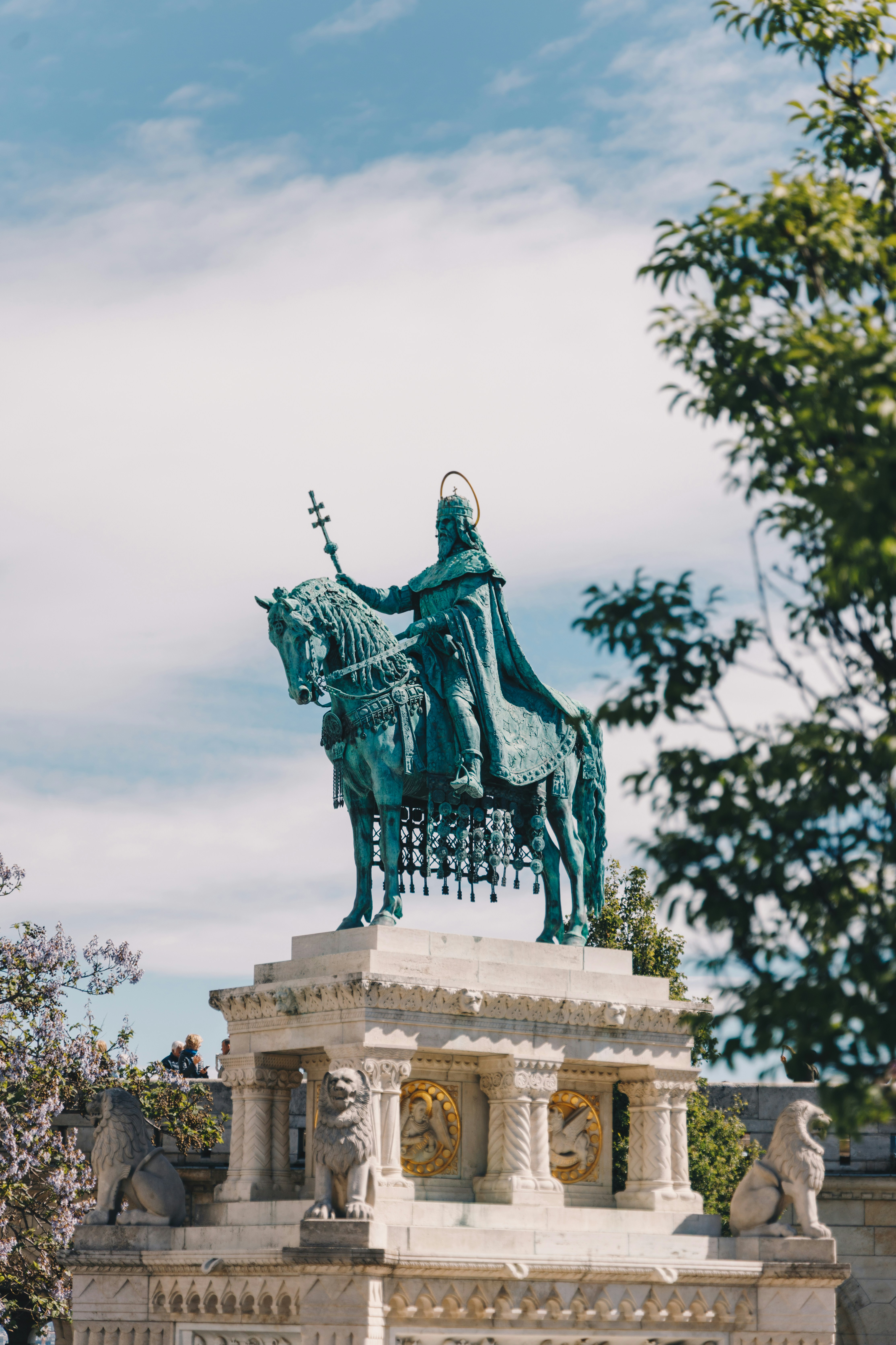 Equestrian Monument in Serenity: A Bronze Rider Over Stone Pedestal