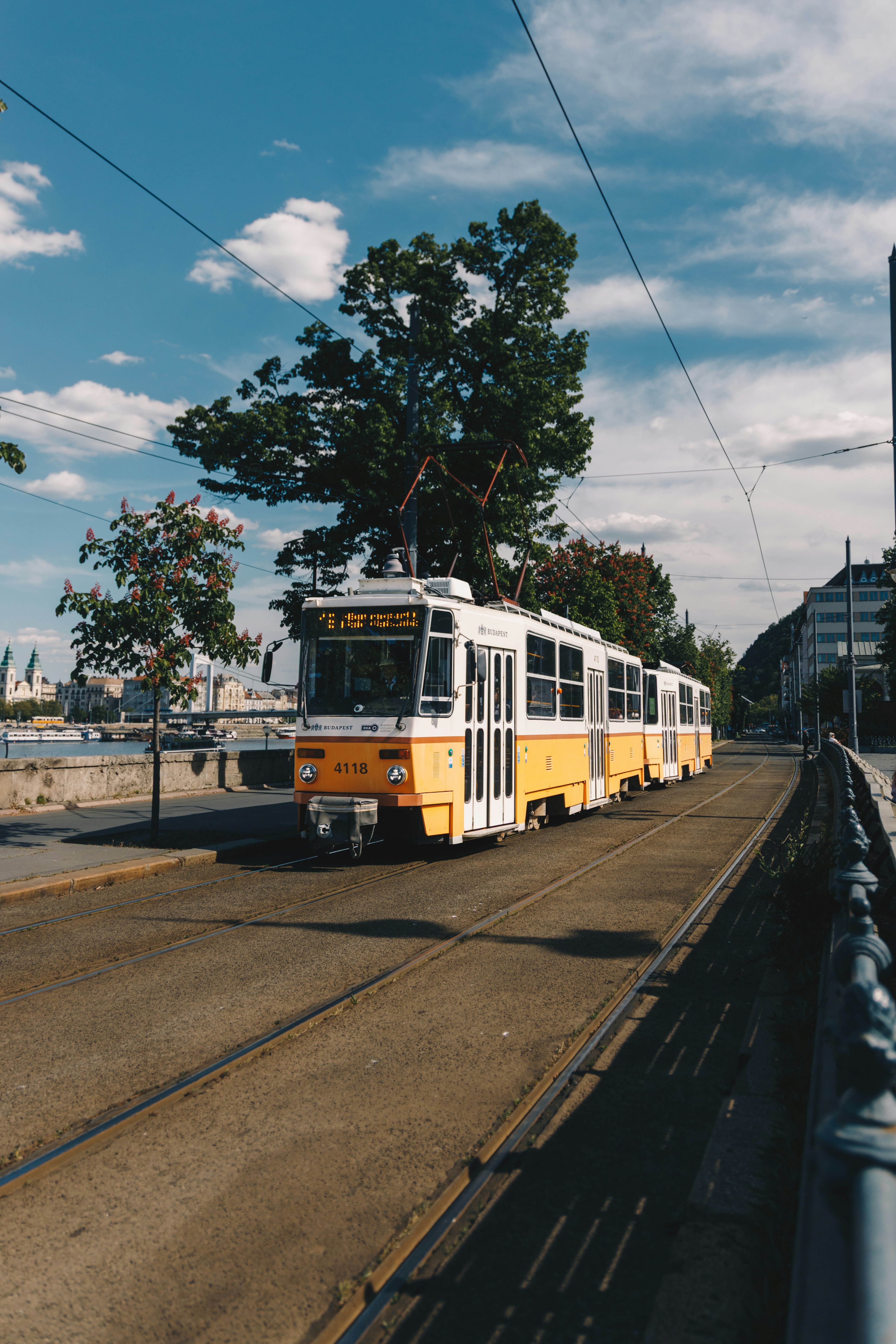 Yellow Tram on a Sunlit City Bridge