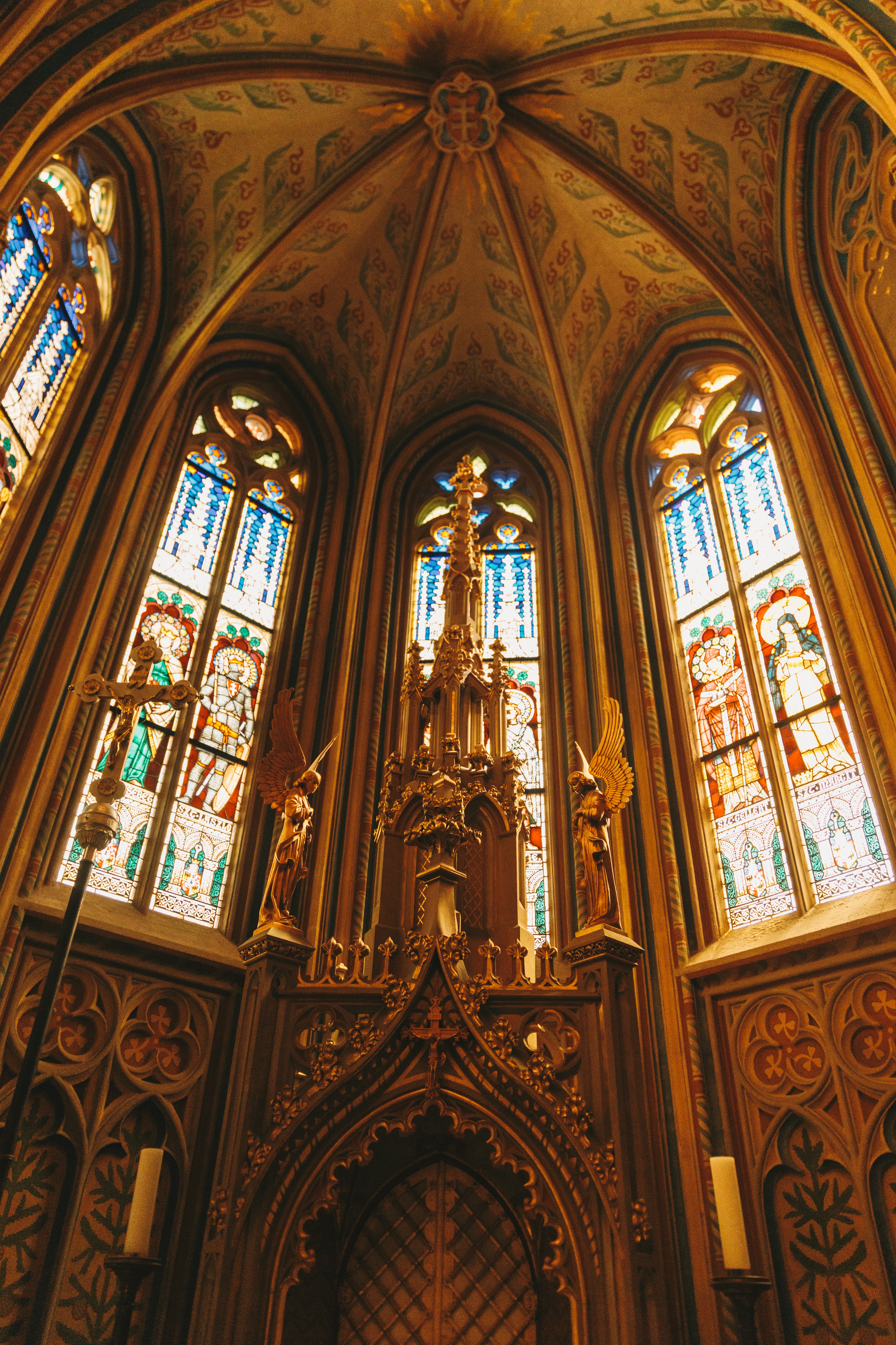 Gothic Chapel Arcades: Stained Glass and Altars in Reverent Light