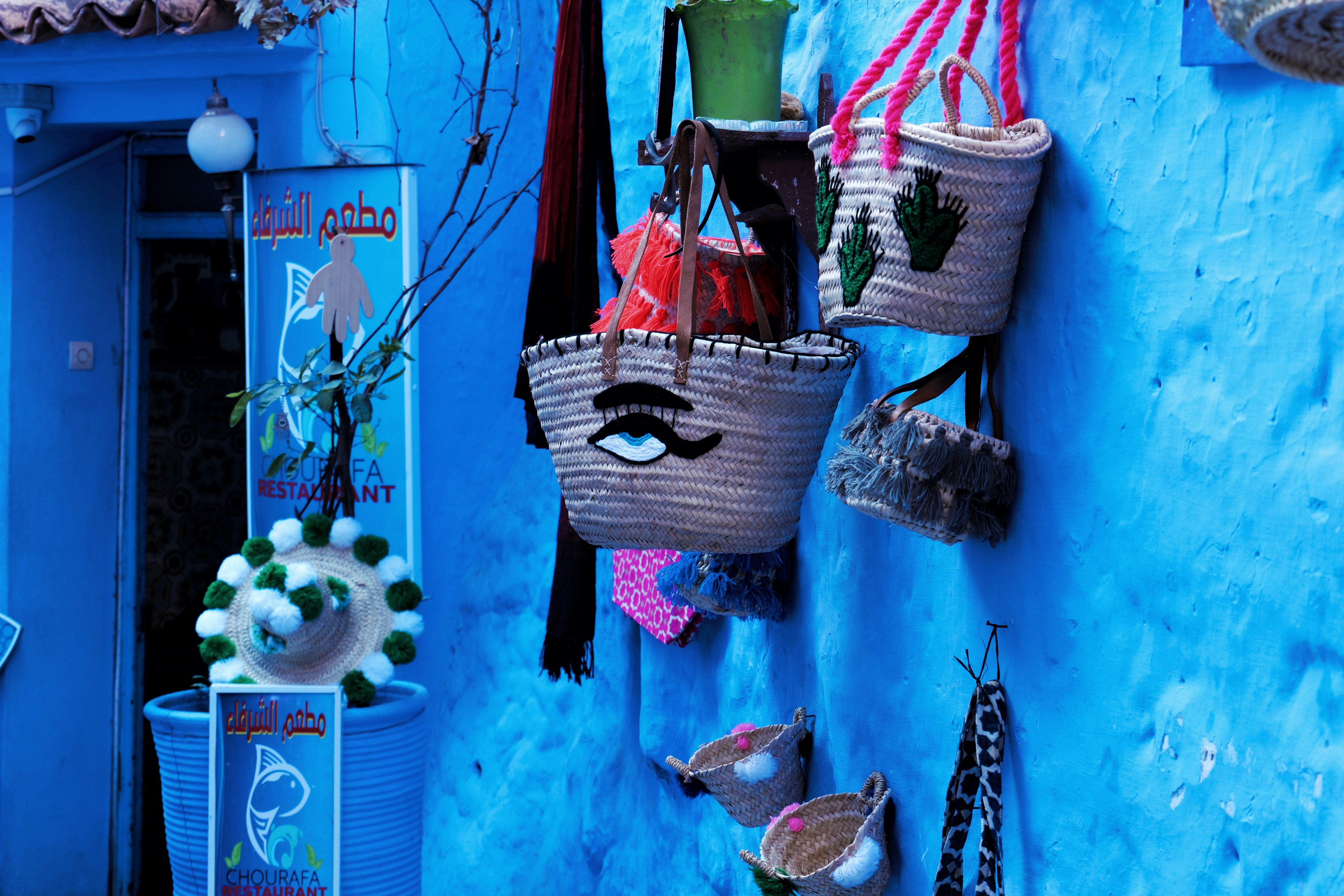Blue Alley Treasures: Woven Baskets on a Cobalt Street