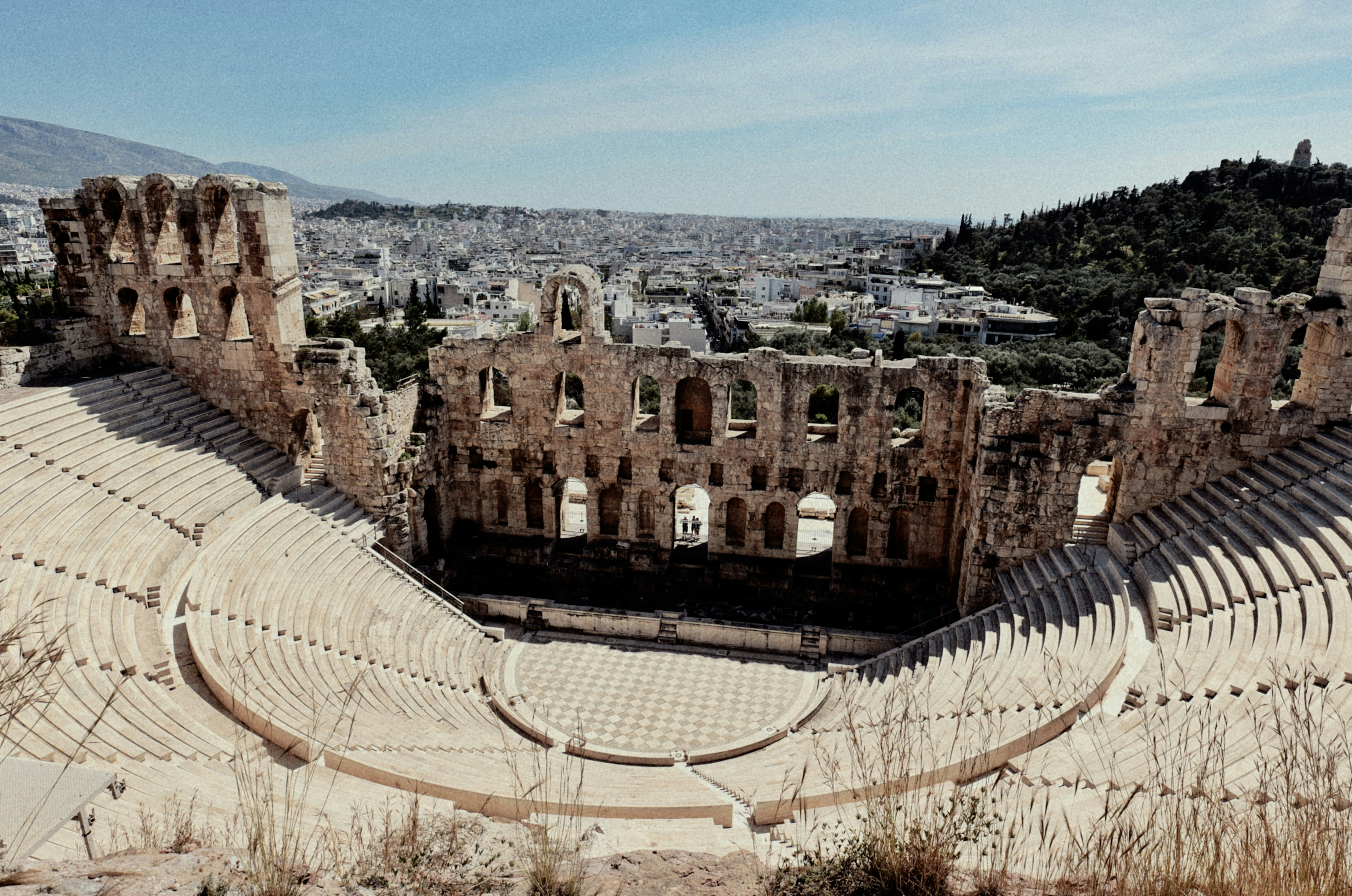 Ancient Amphitheater Overlooking a Modern City
