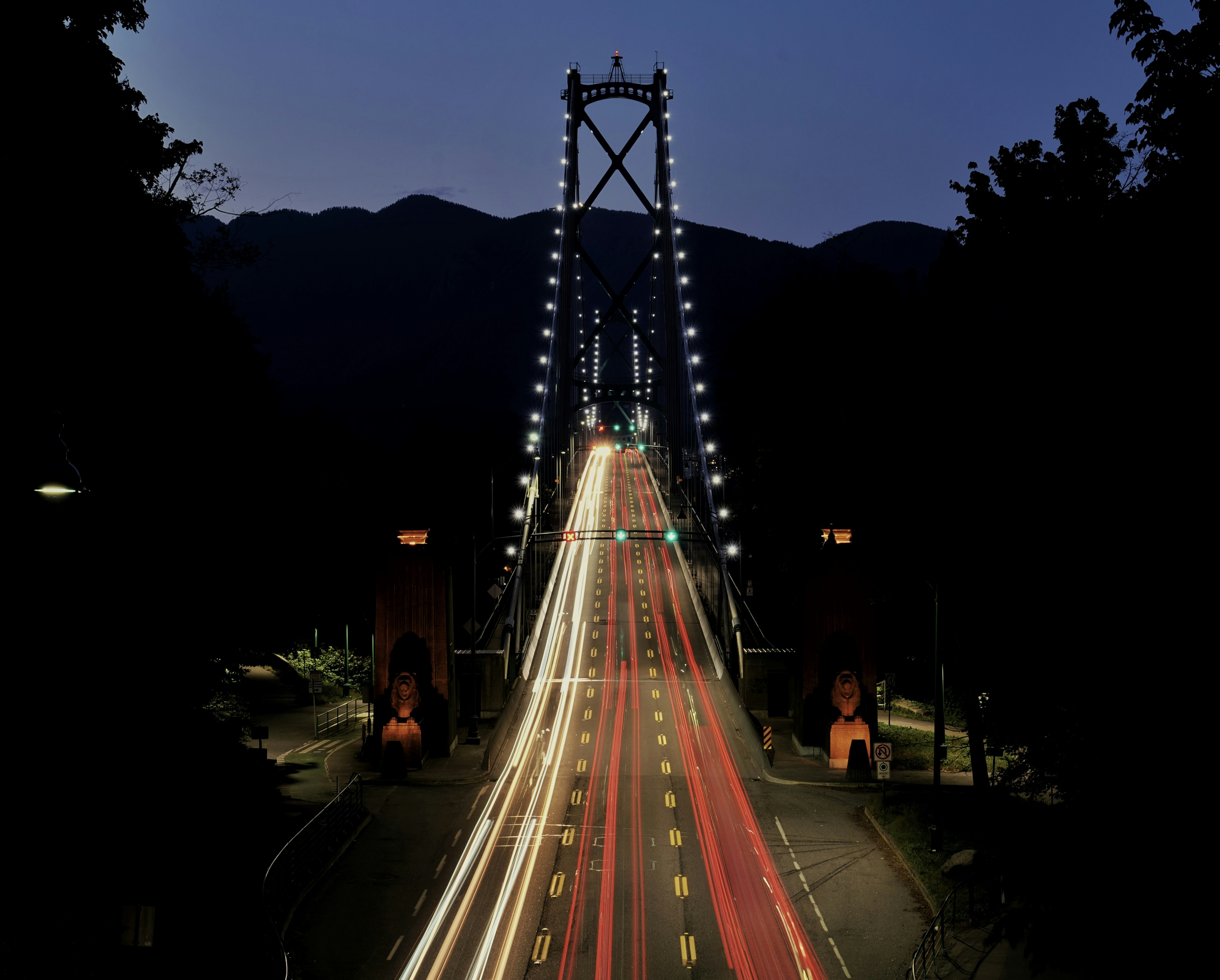 Lights Over the Valley: A Night Crossing on a Sparkling Bridge