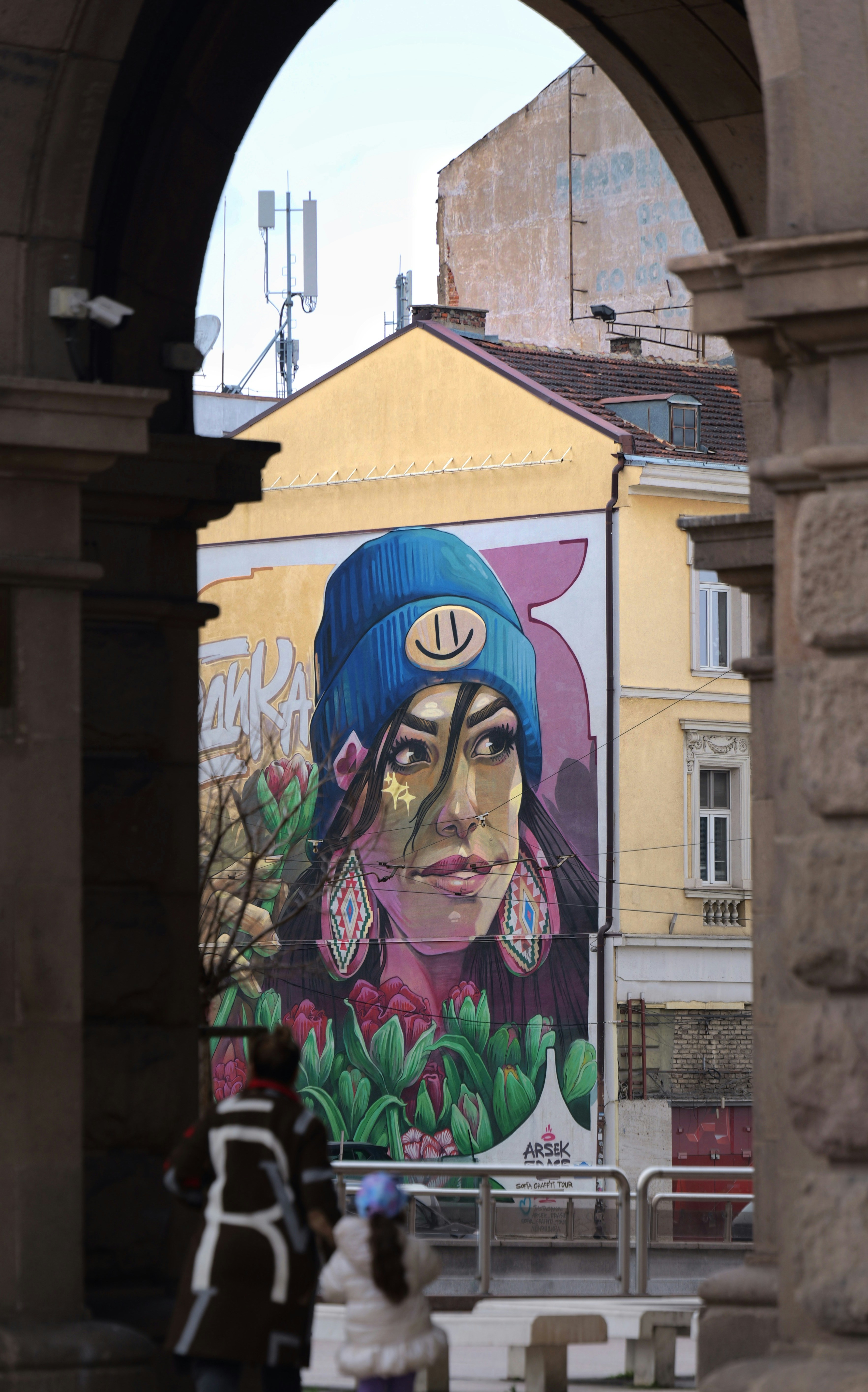 Urban Graffiti Portrait Framed by an Archway