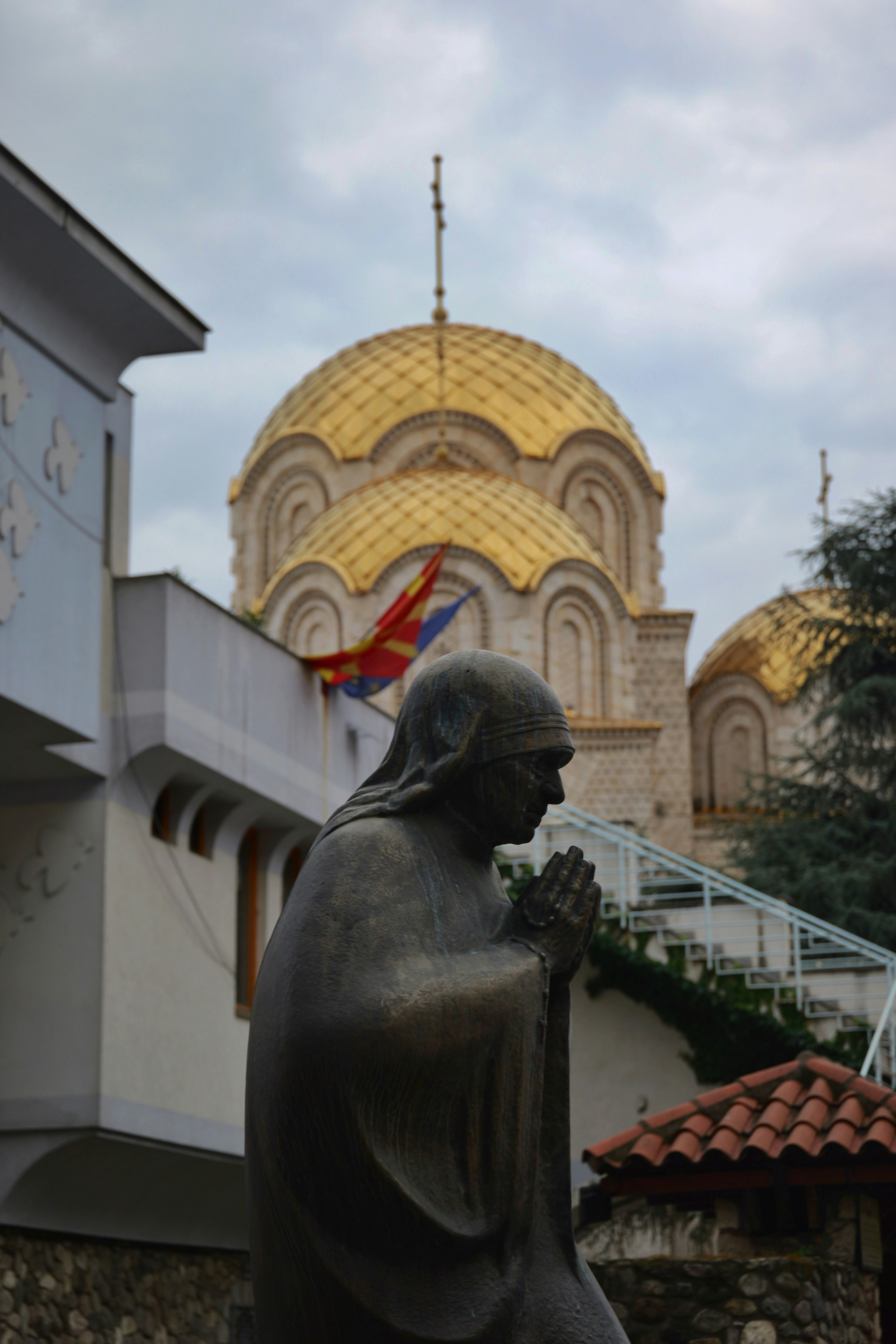 Praying Figures and Golden Domes