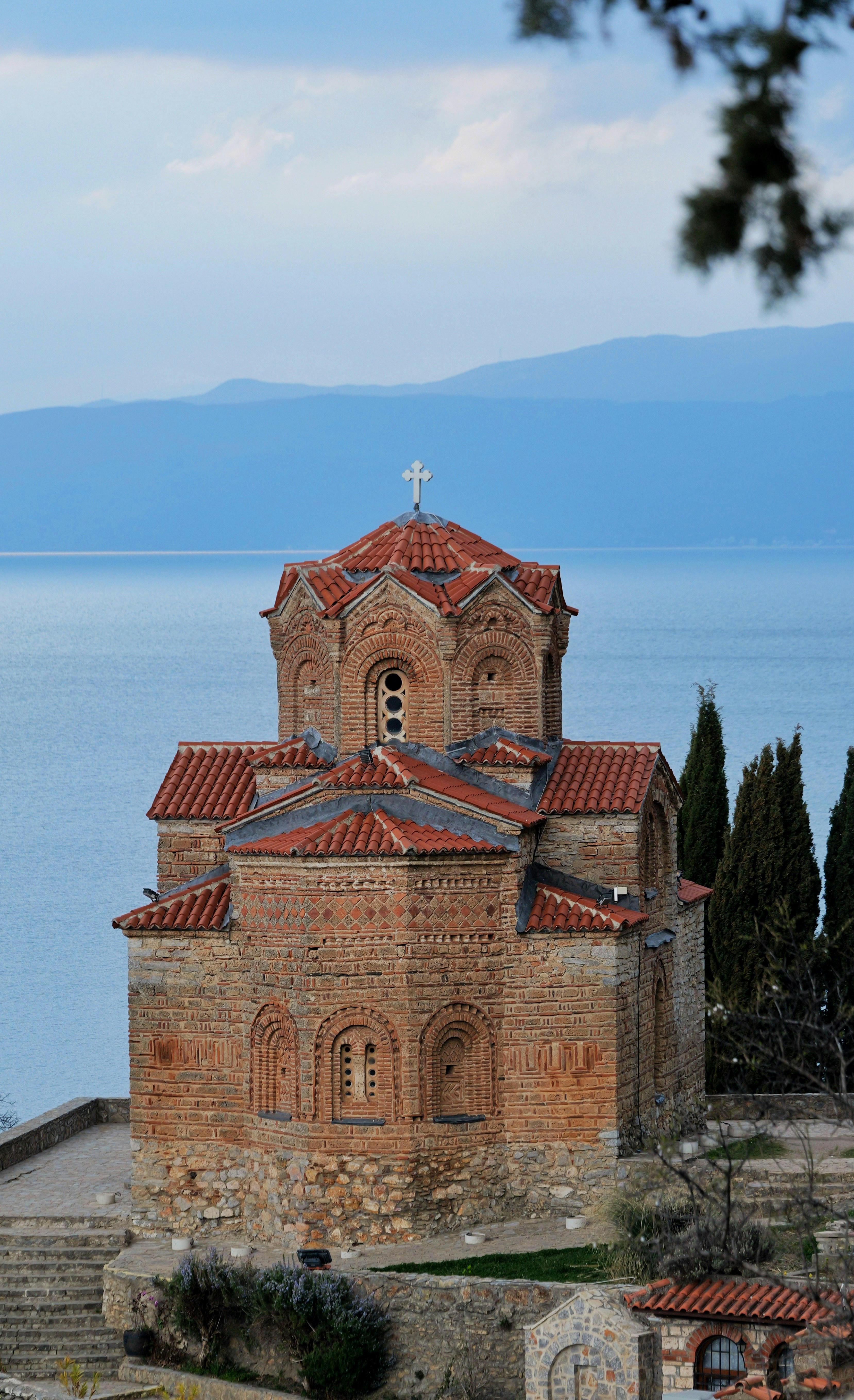 Distant Blue Horizon Behind a Red-Tiled Byzantine Church