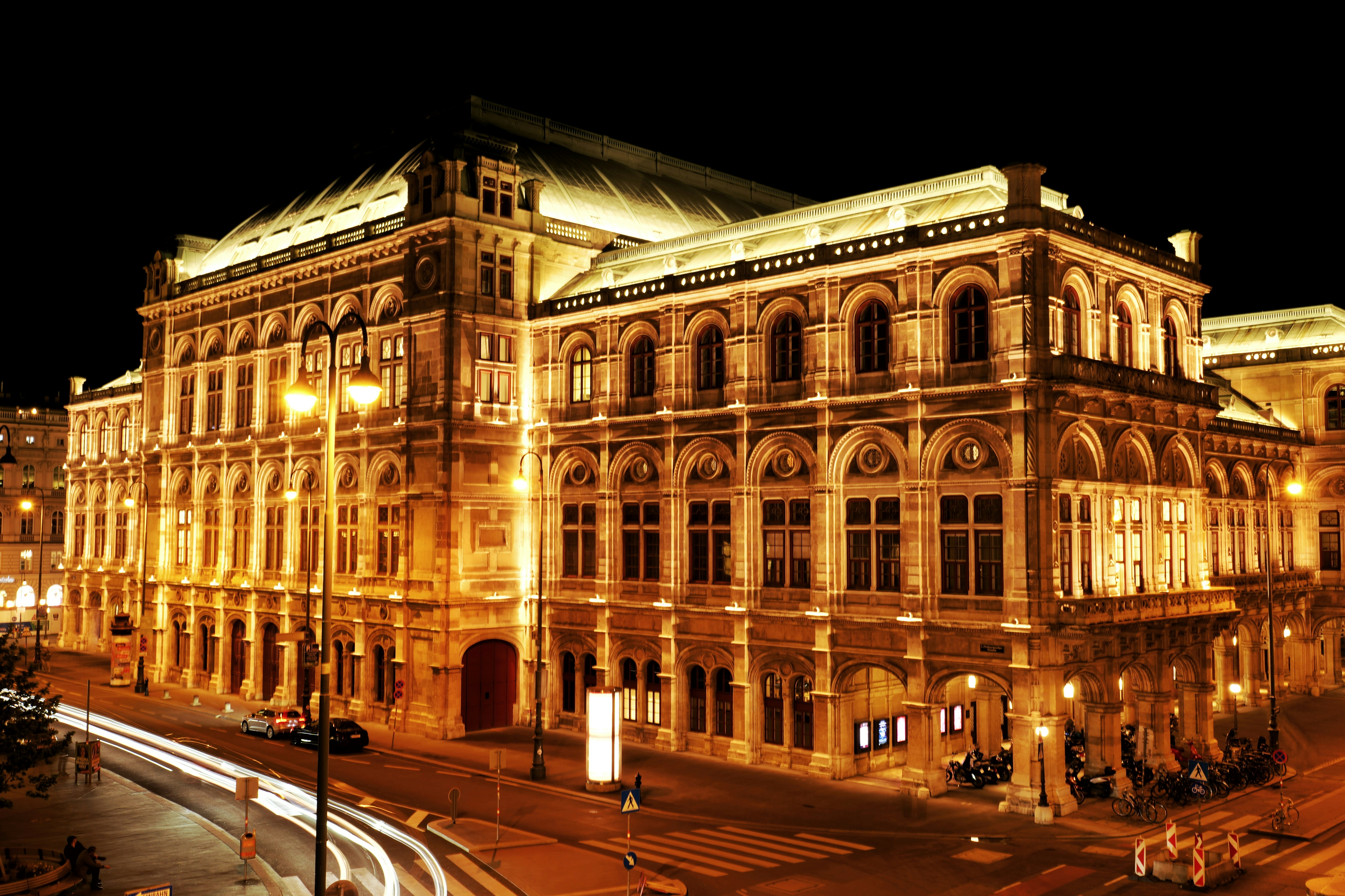 Golden Facade at Night: A Streetcar's Whisper Along the Historic Marble
