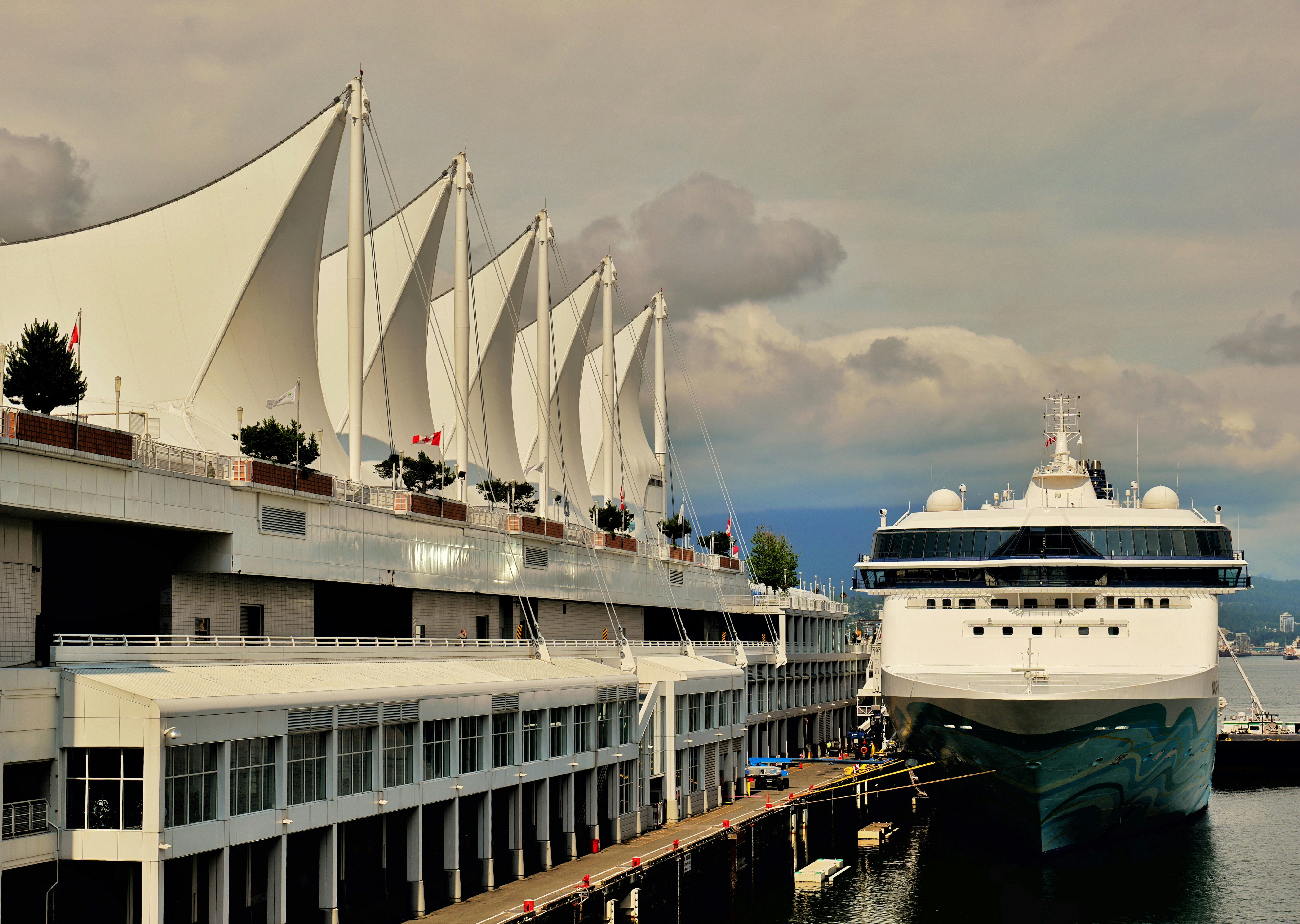 Docked Giants: A Cruise Ship at the Tech-Forward Terminal
