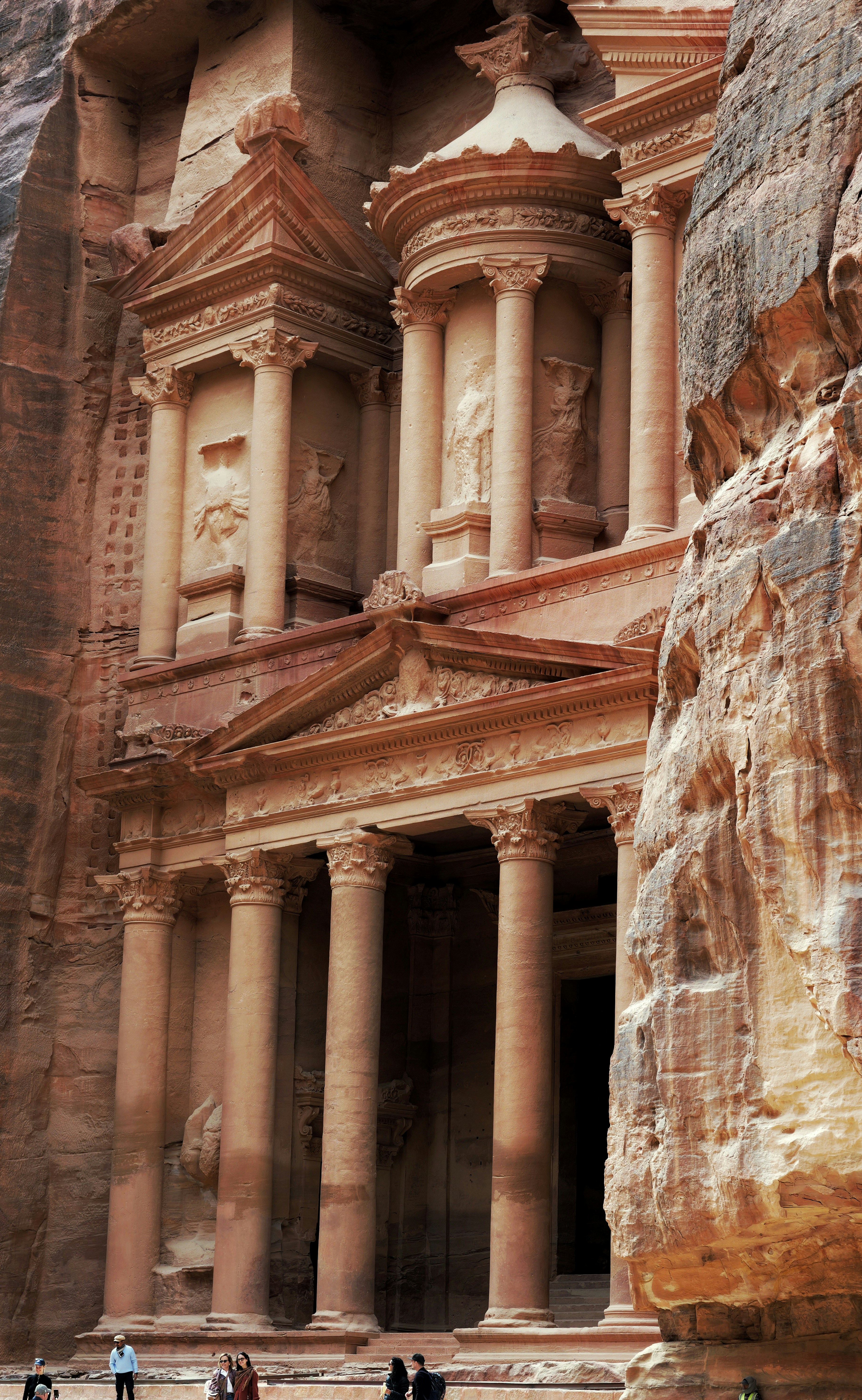 Carved Ancient Facade Rising from Reddish Stone