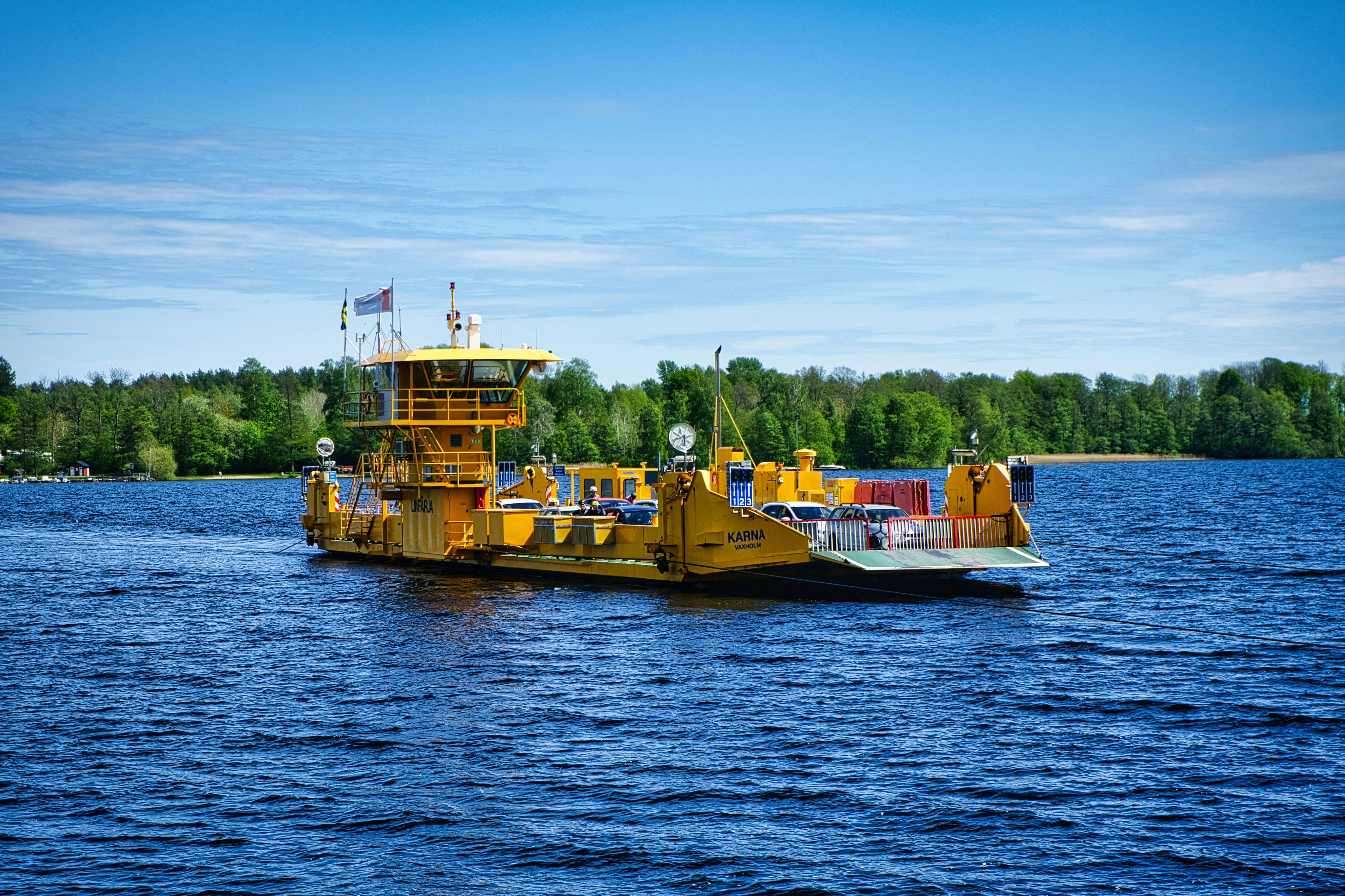 Yellow Tug Across a Quiet Blue Lake