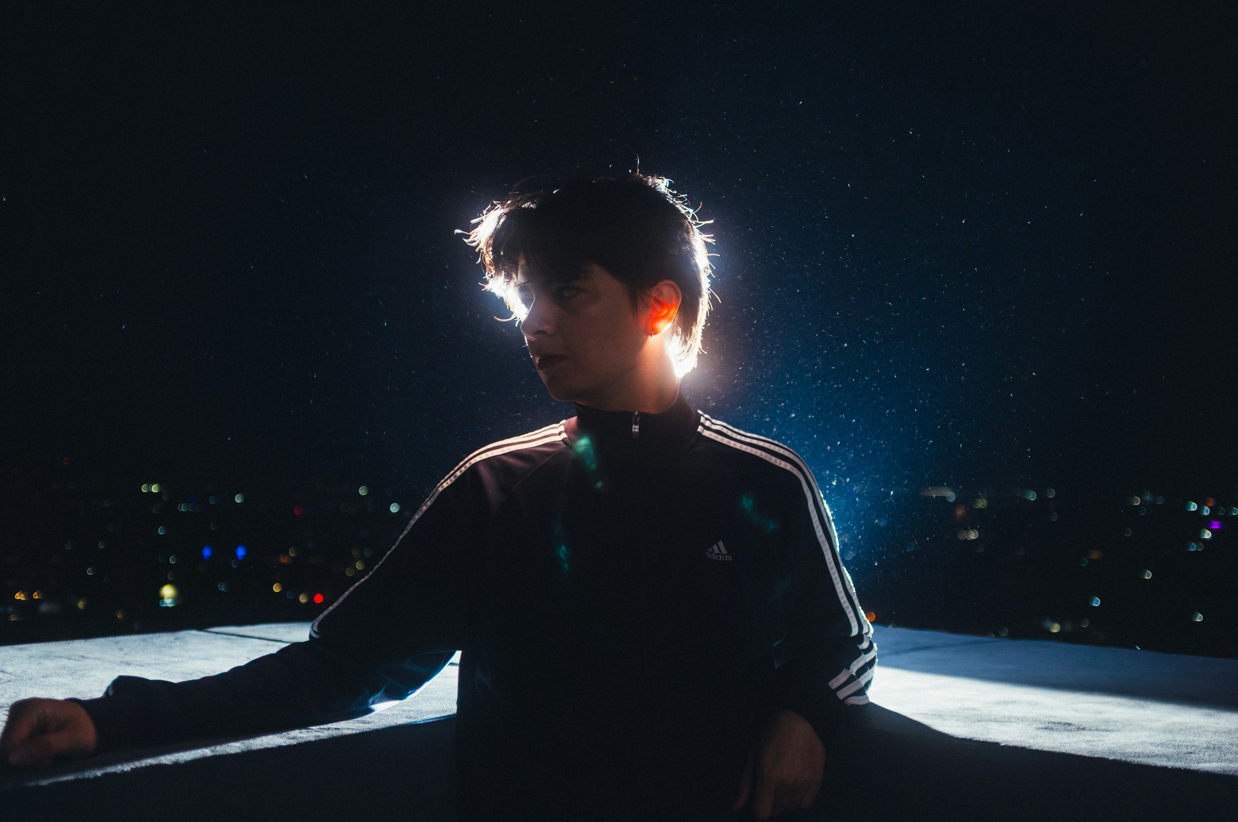 Nightfall on the Rooftop: A Quiet Portrait in Neon Sky