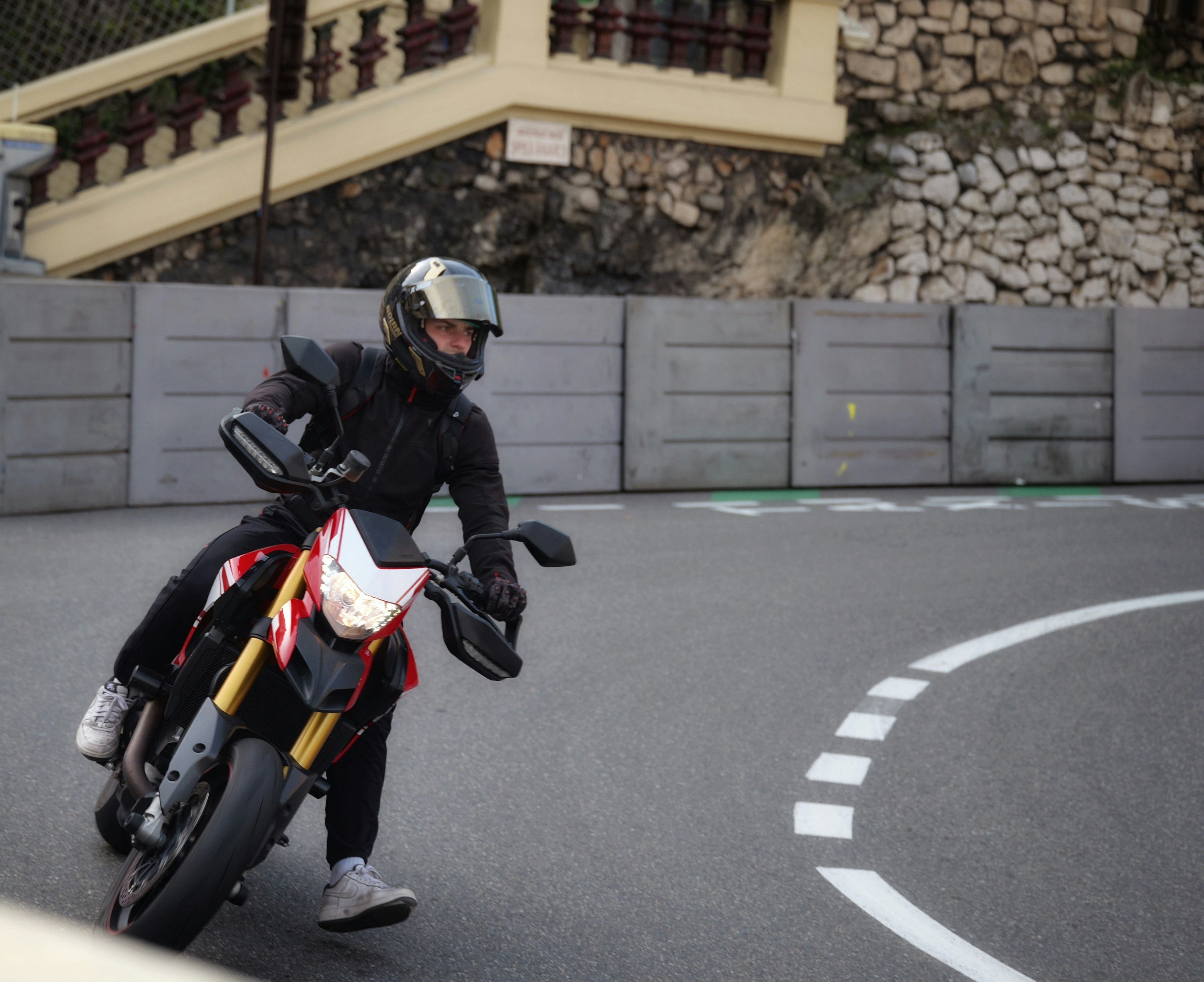 Motorcycle Turn: Rider Navigates a Tight Bend