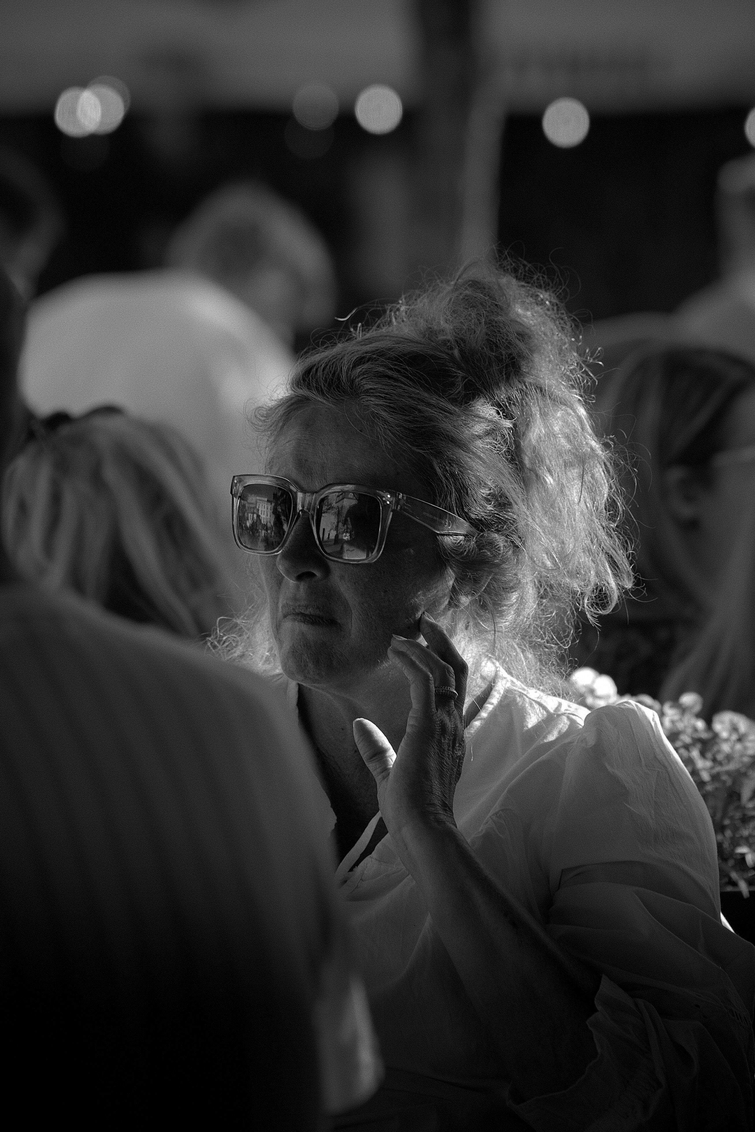 Silhouetted Portrait in Soft Bustle of a Busy Setting