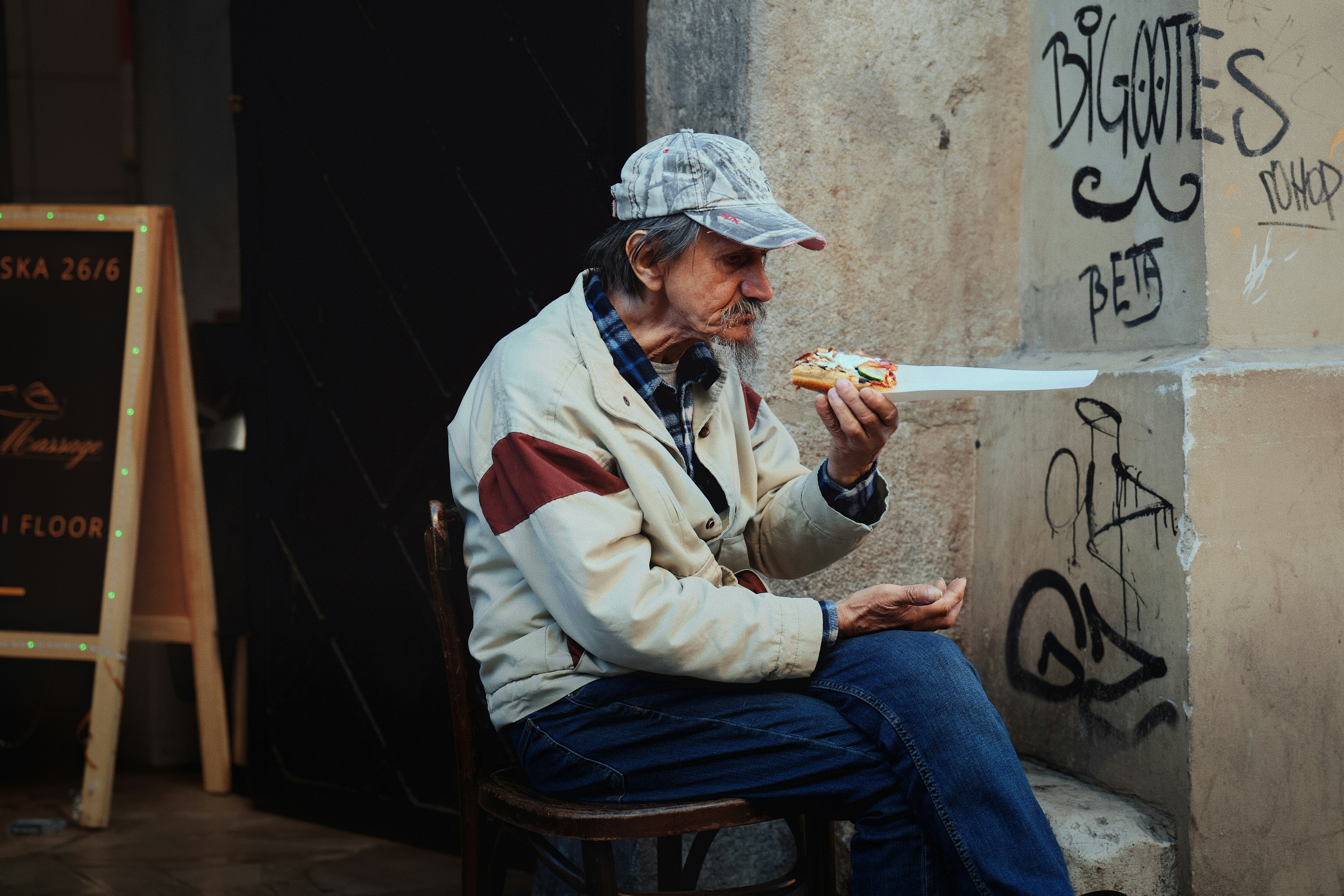 Portrait of a Street Vendor: Quiet Moment with a Slice of Light