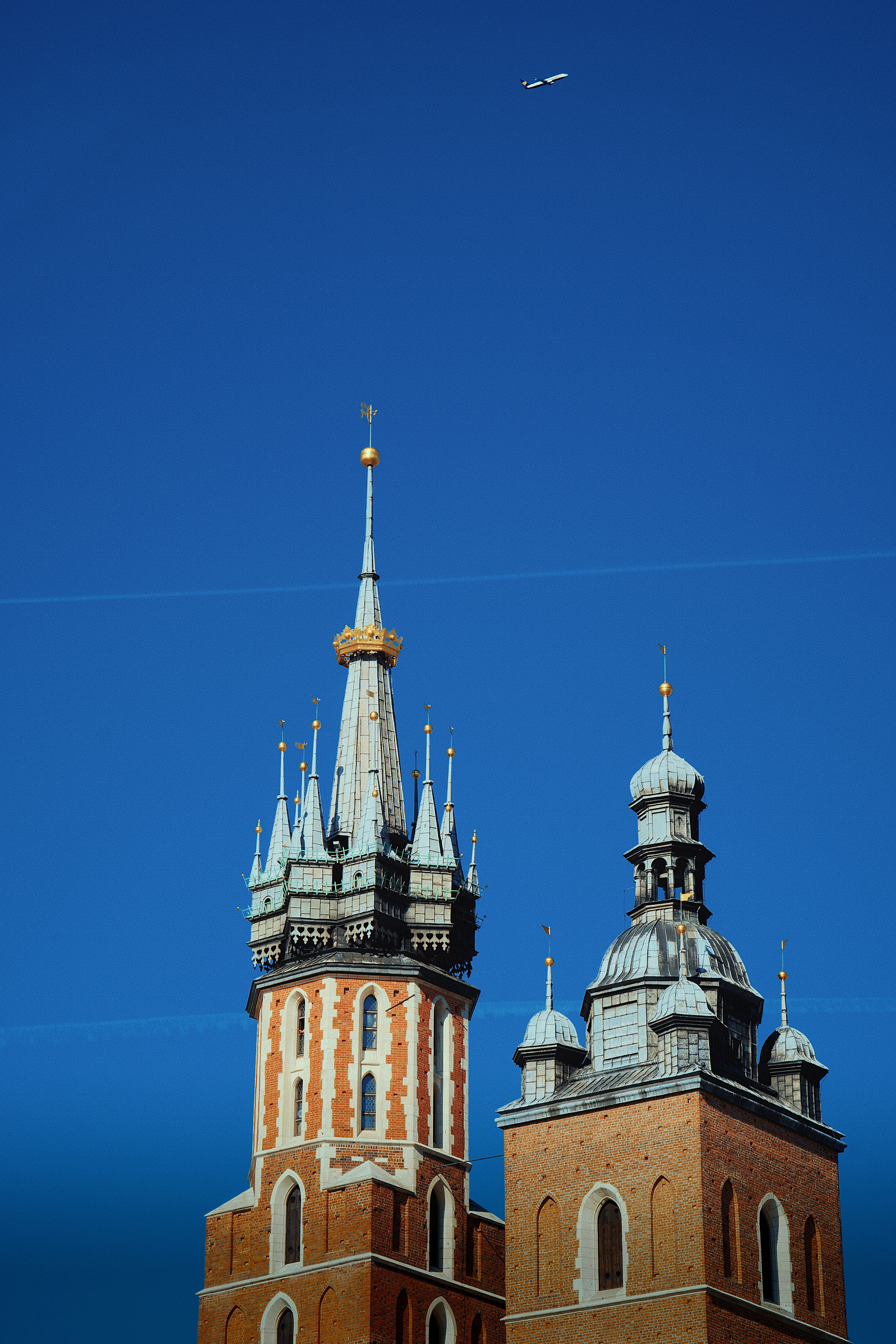 Crown and Clock: A City Tower Reaching Toward a Clear Sky