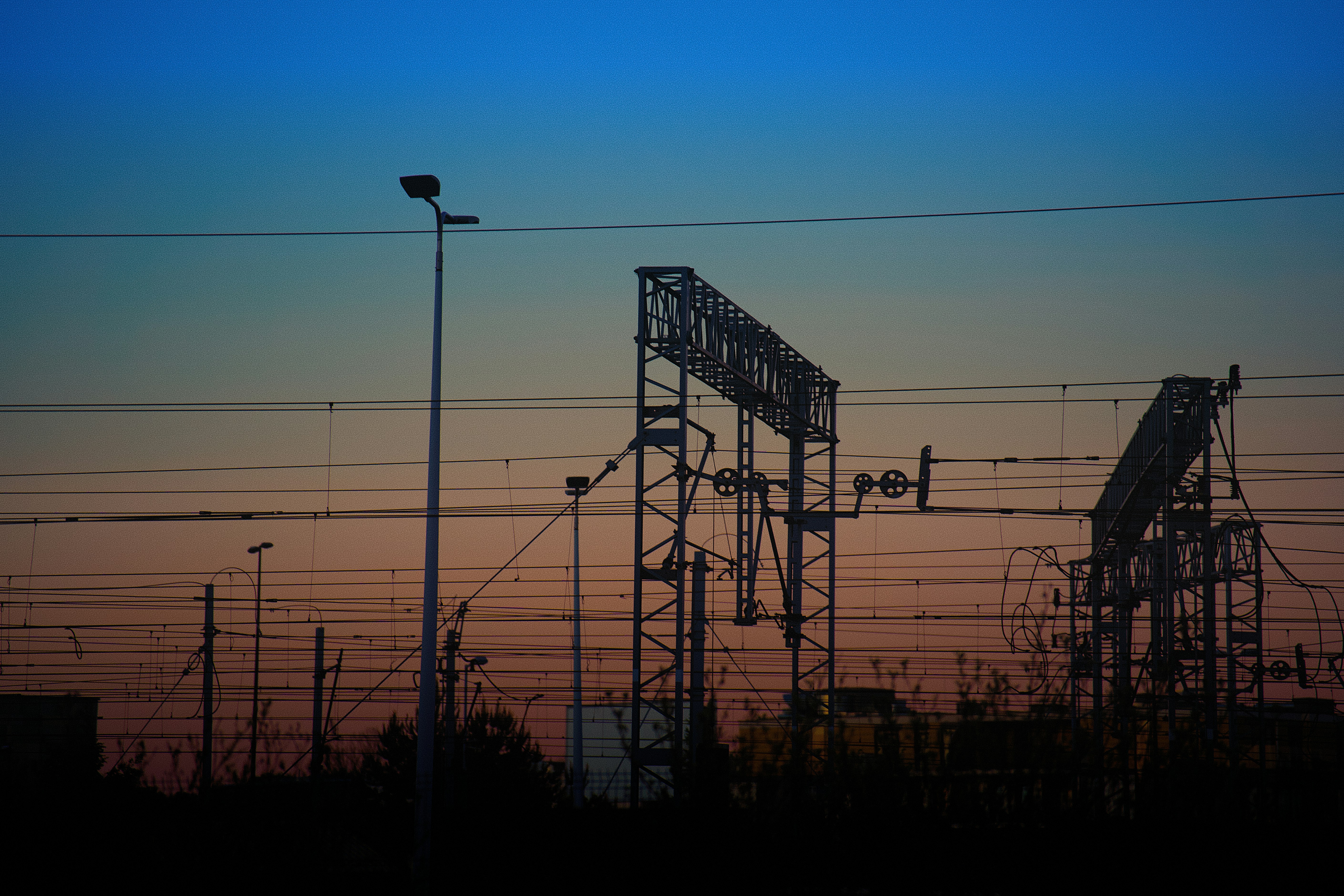 Silhouetted Suburban Rails at Dusk