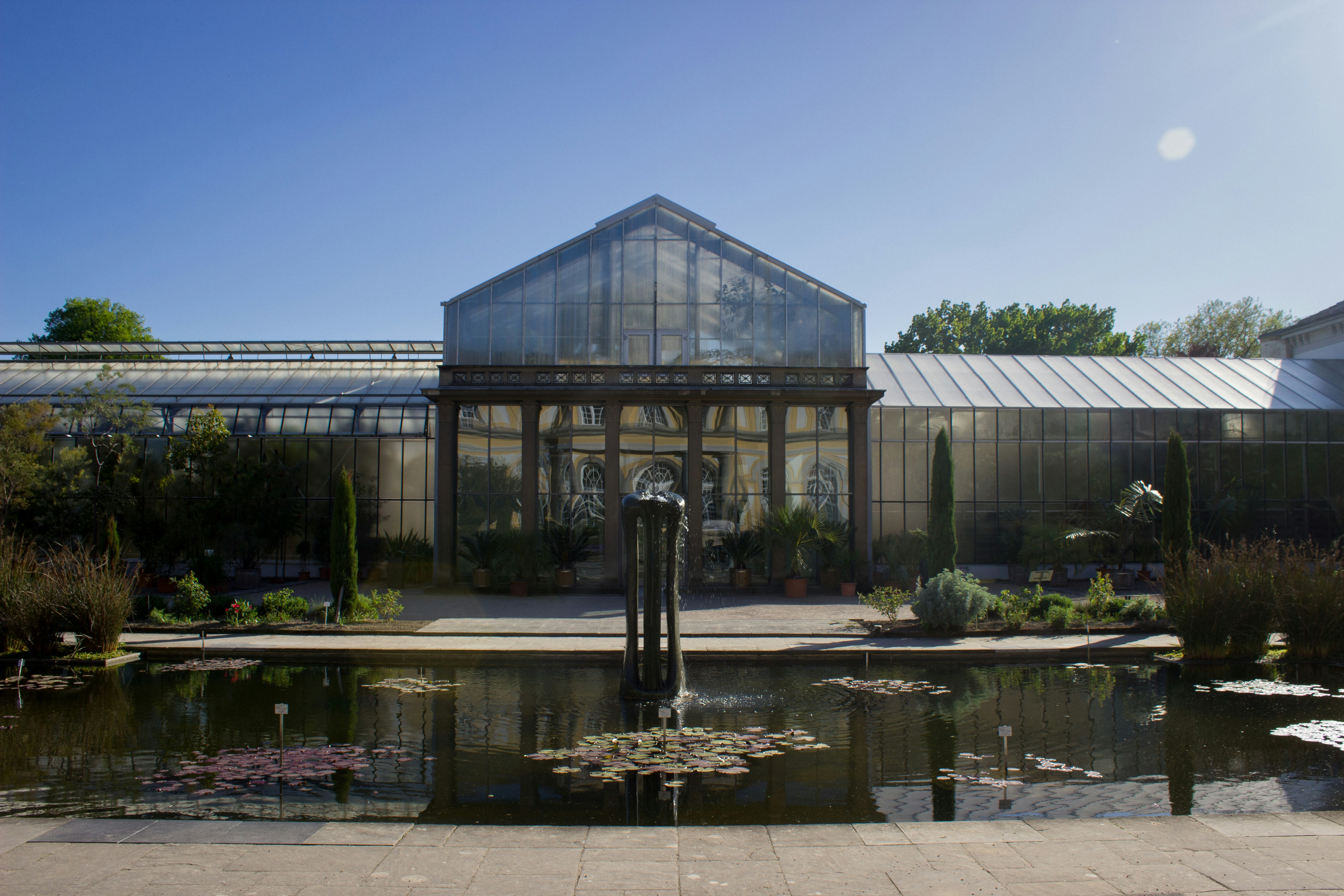 Glasshouse Reflections: Symmetry Over the Pond