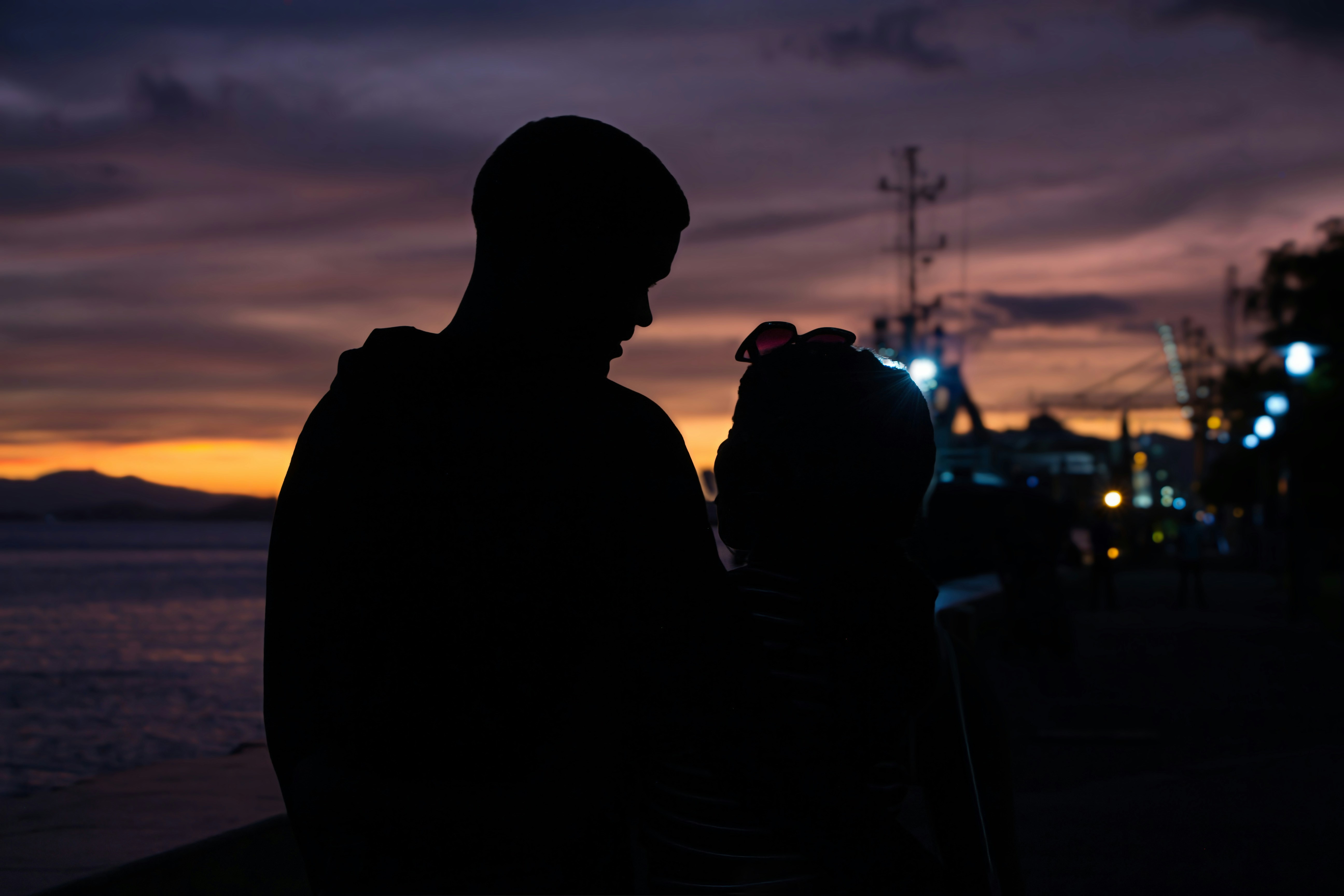 Silhouettes at Dusk by the Waterfront