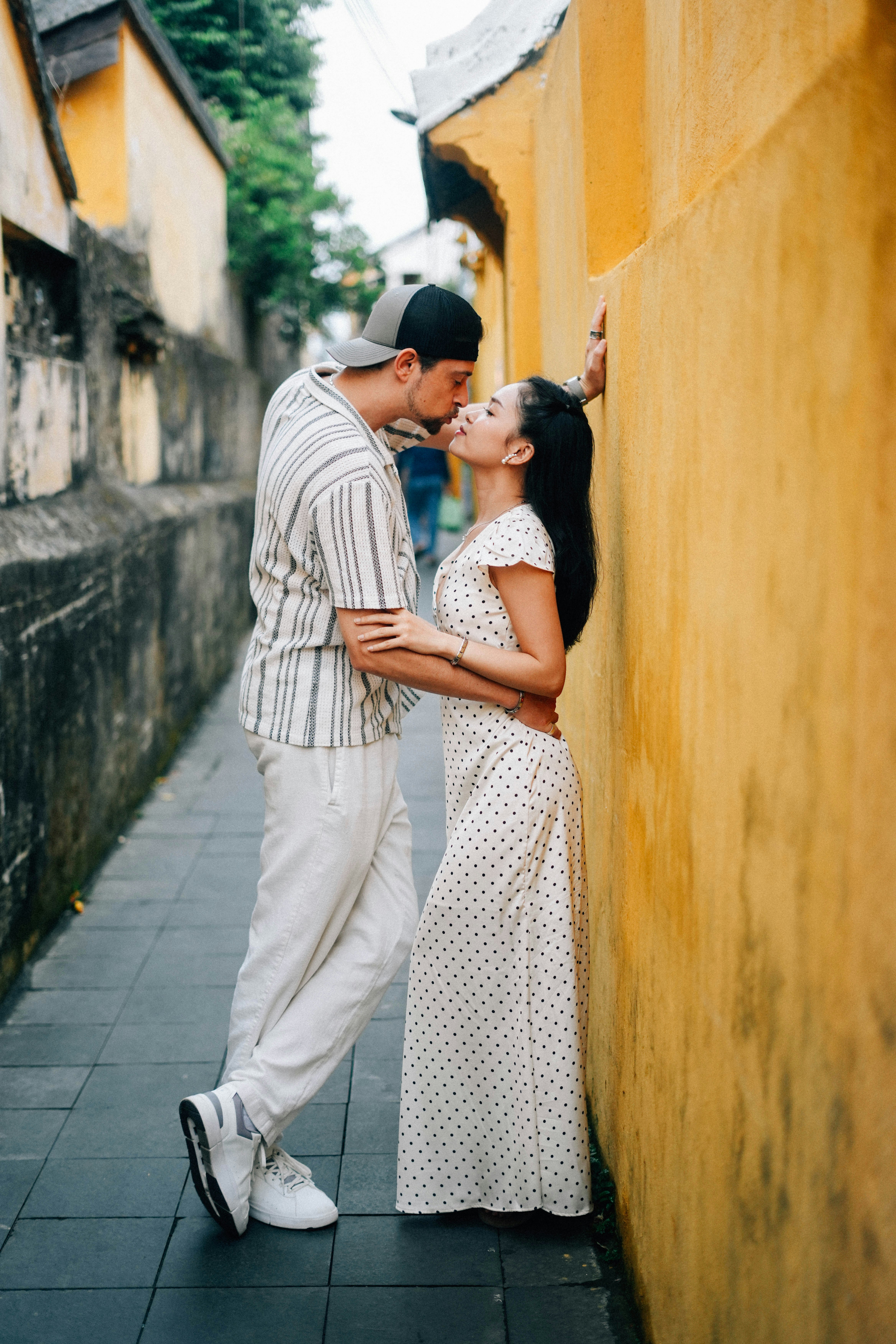 Close-Kiss in a Sunlit Alleyway