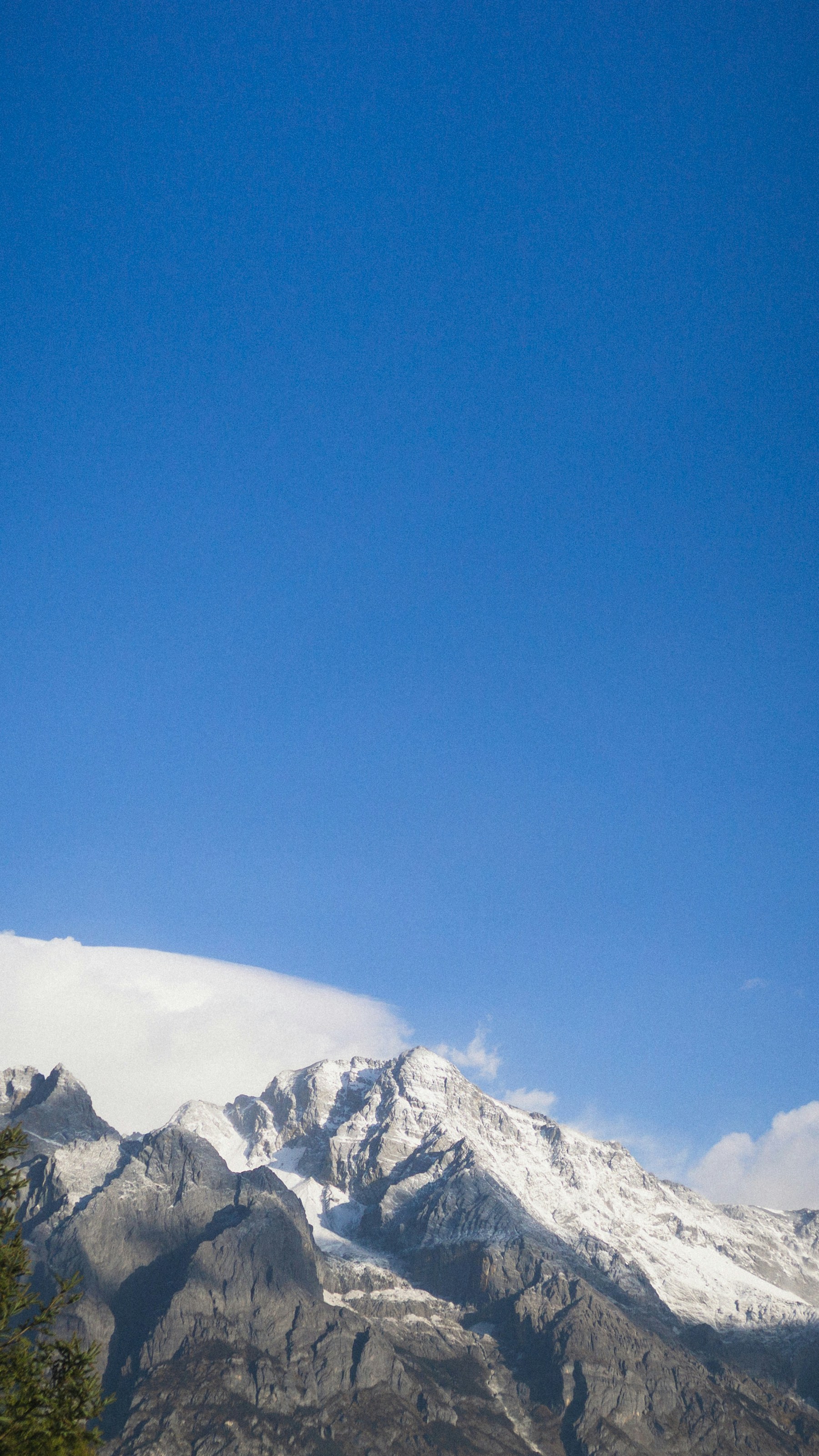 Snow-capped Peaks Under a Pristine Blue Sky
