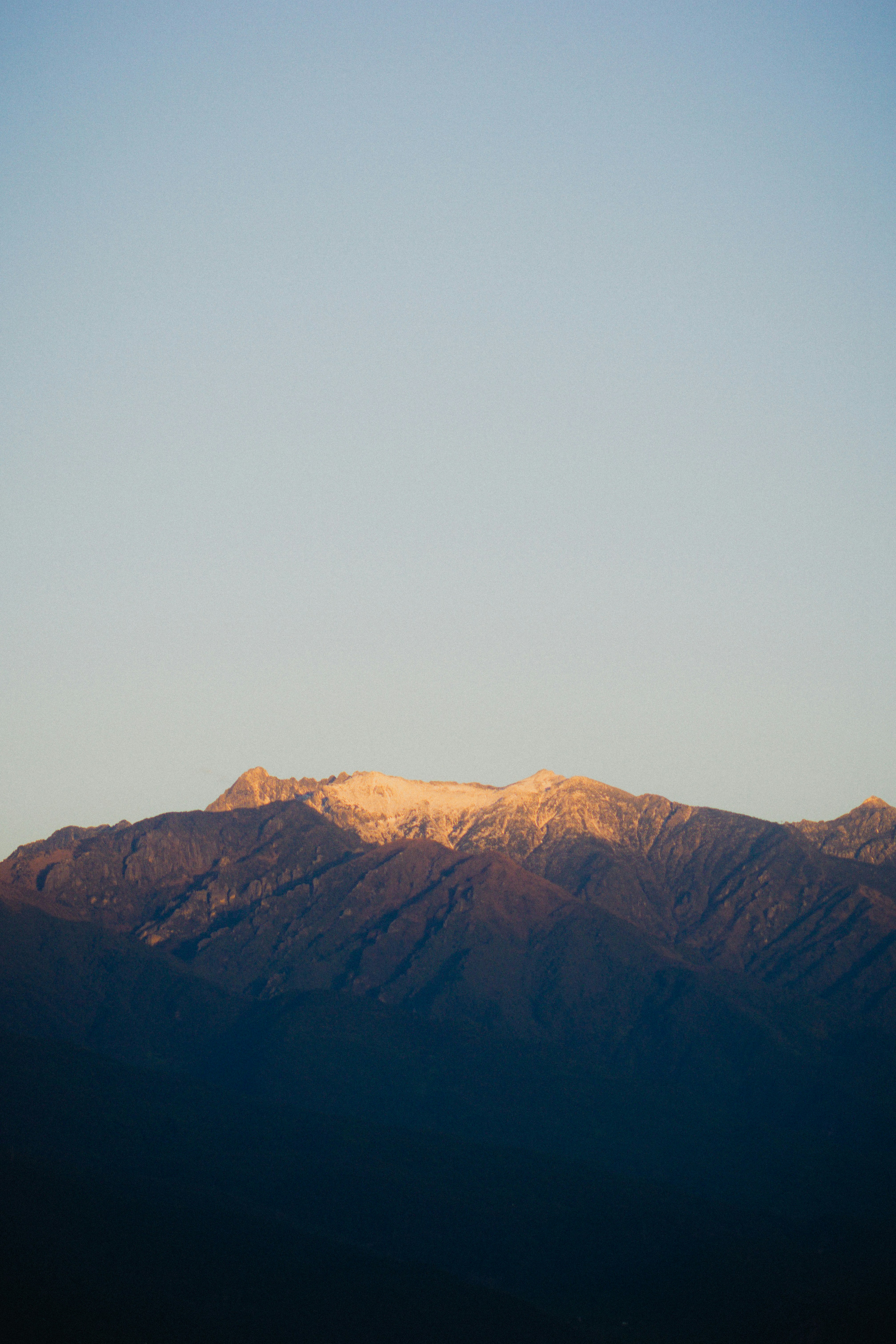 Golden Crest: Sunrise Light Grips a Mountain Ridge