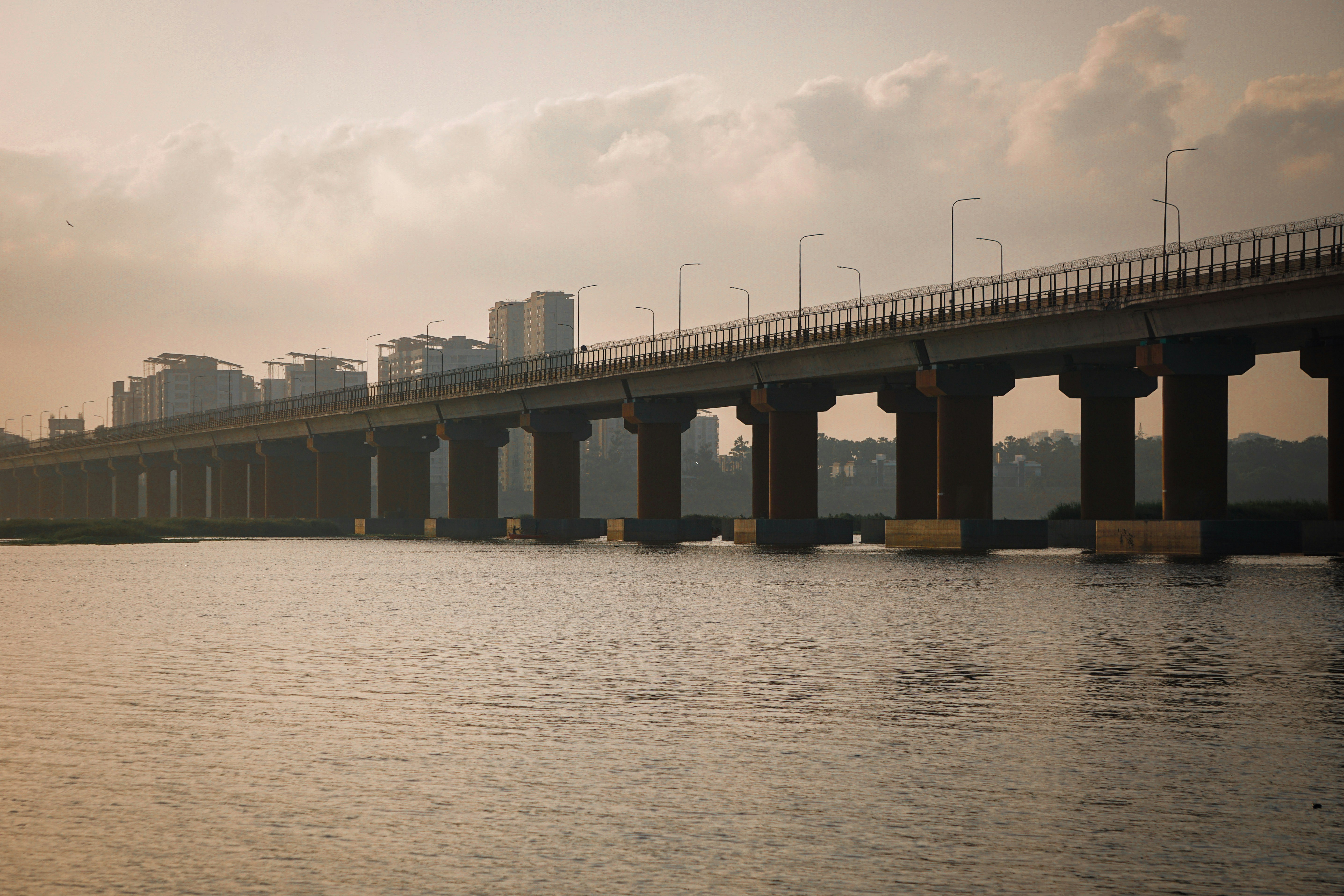 Sunset Over Water: A Quiet Bridge Breathes Evening Light
