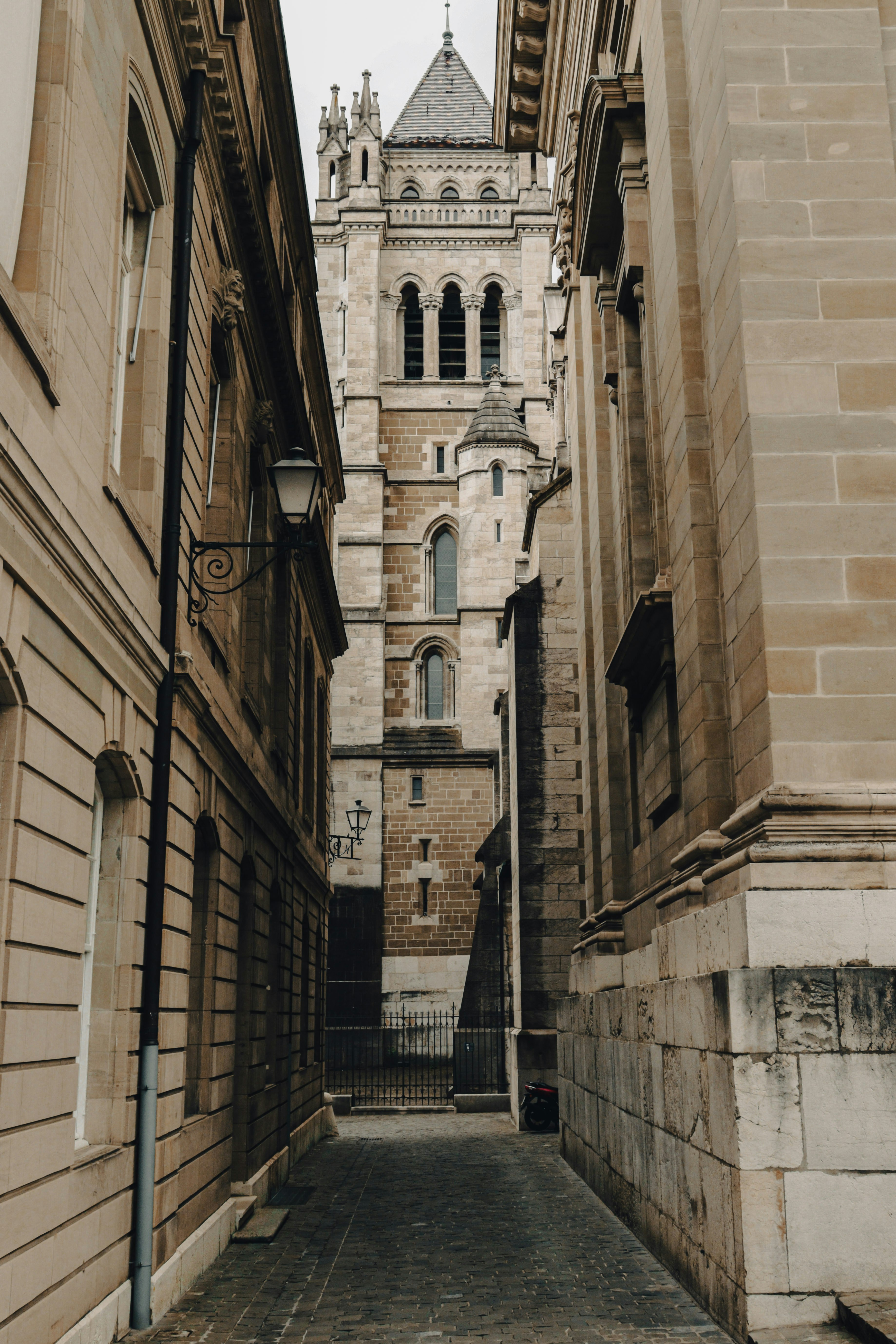 Gothic Arcade: Narrow Alleys Framing a Towering Facade