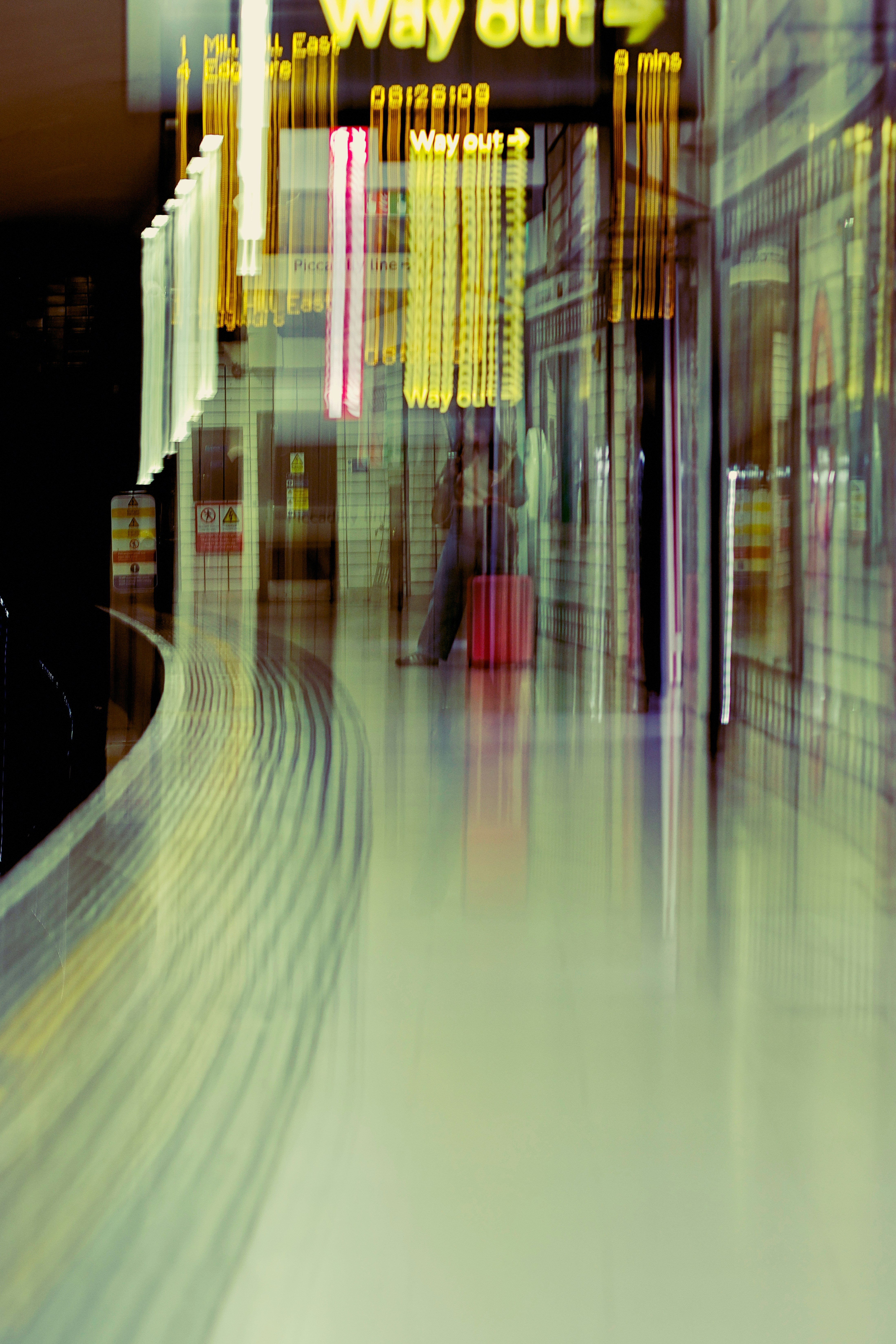 Neon Echoes: Urban Lights Bleed into the Moving Glass
