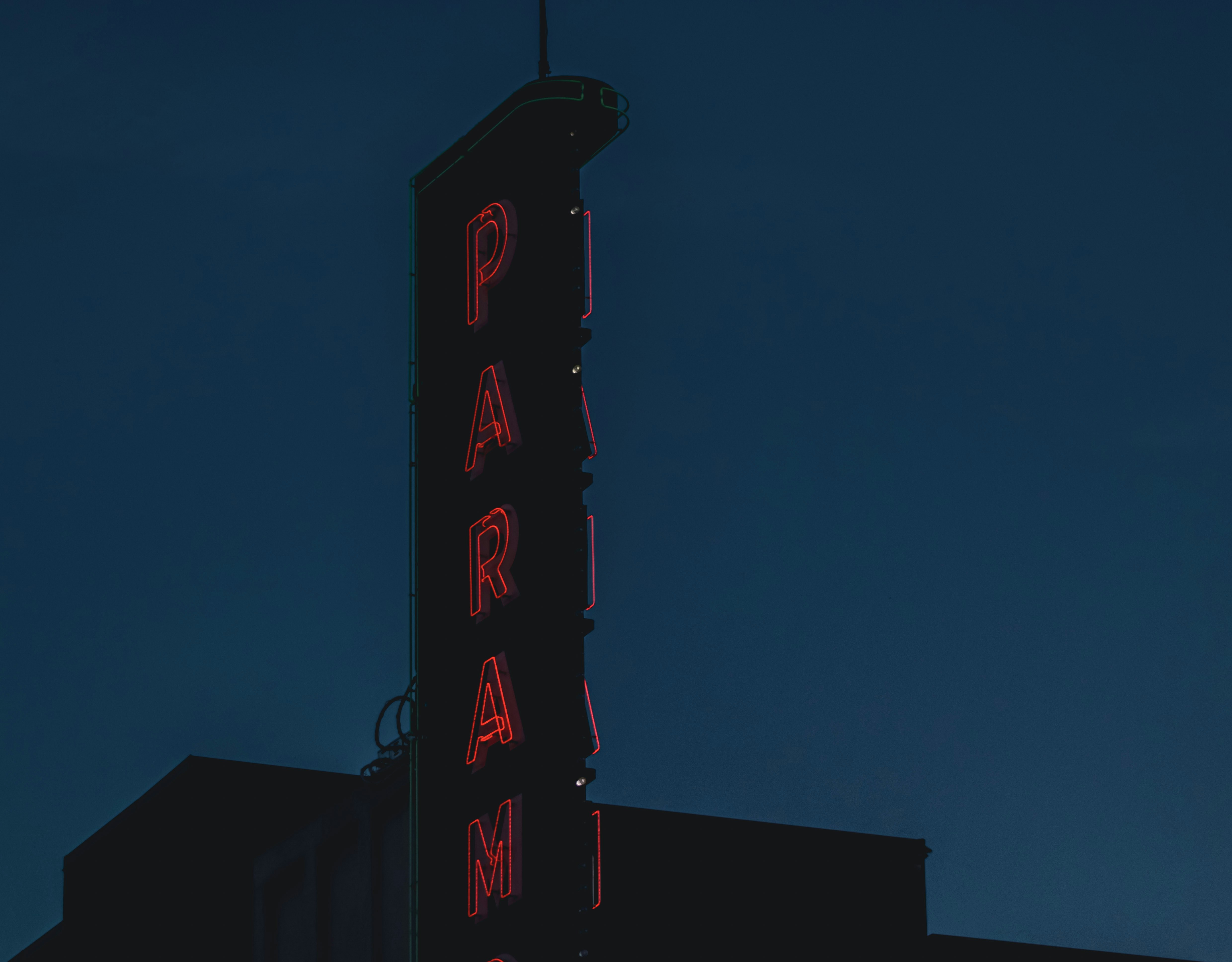 Neon Sign in the Dusk: PARIS Motel at Night