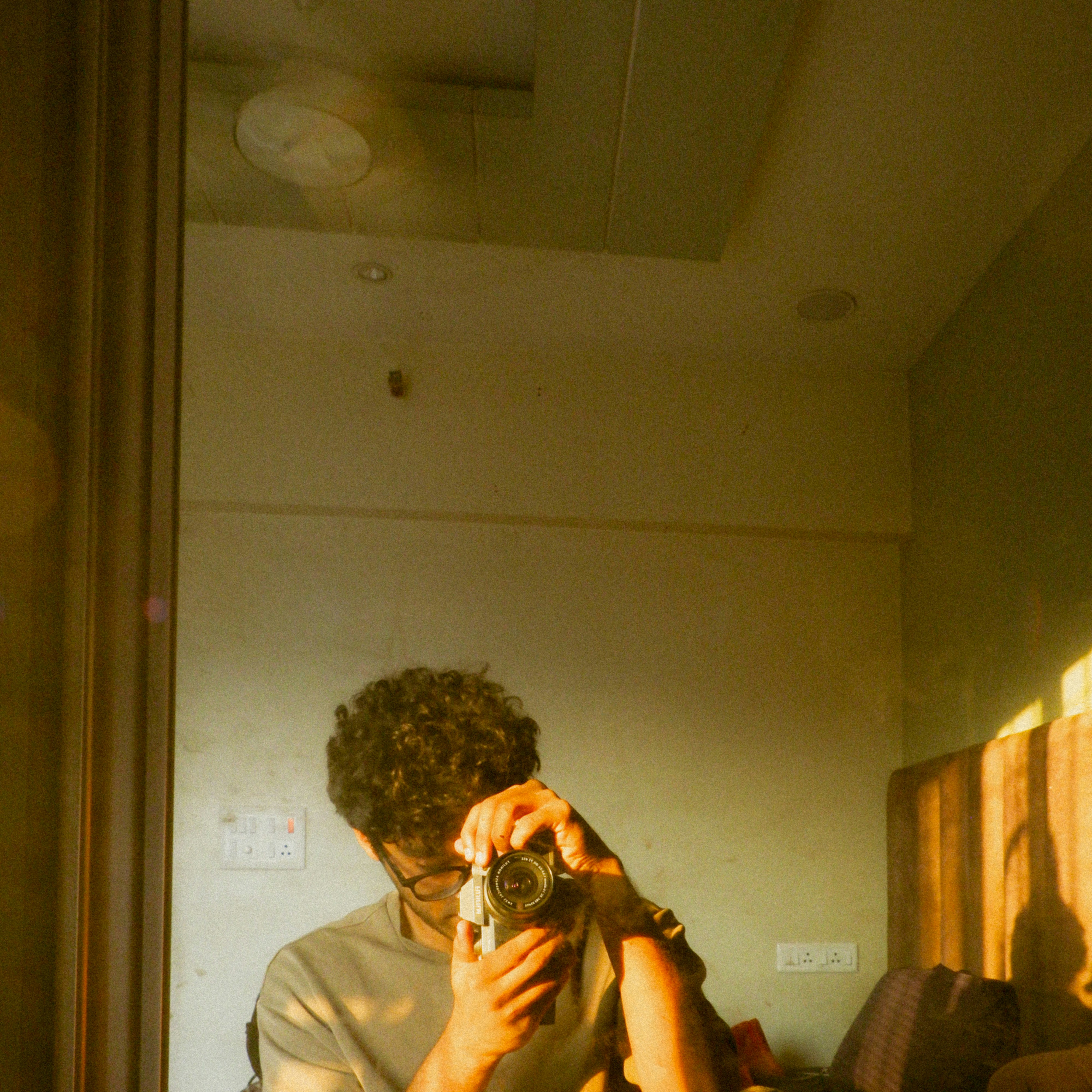 Mirror Portrait in a Dim Dressing Room