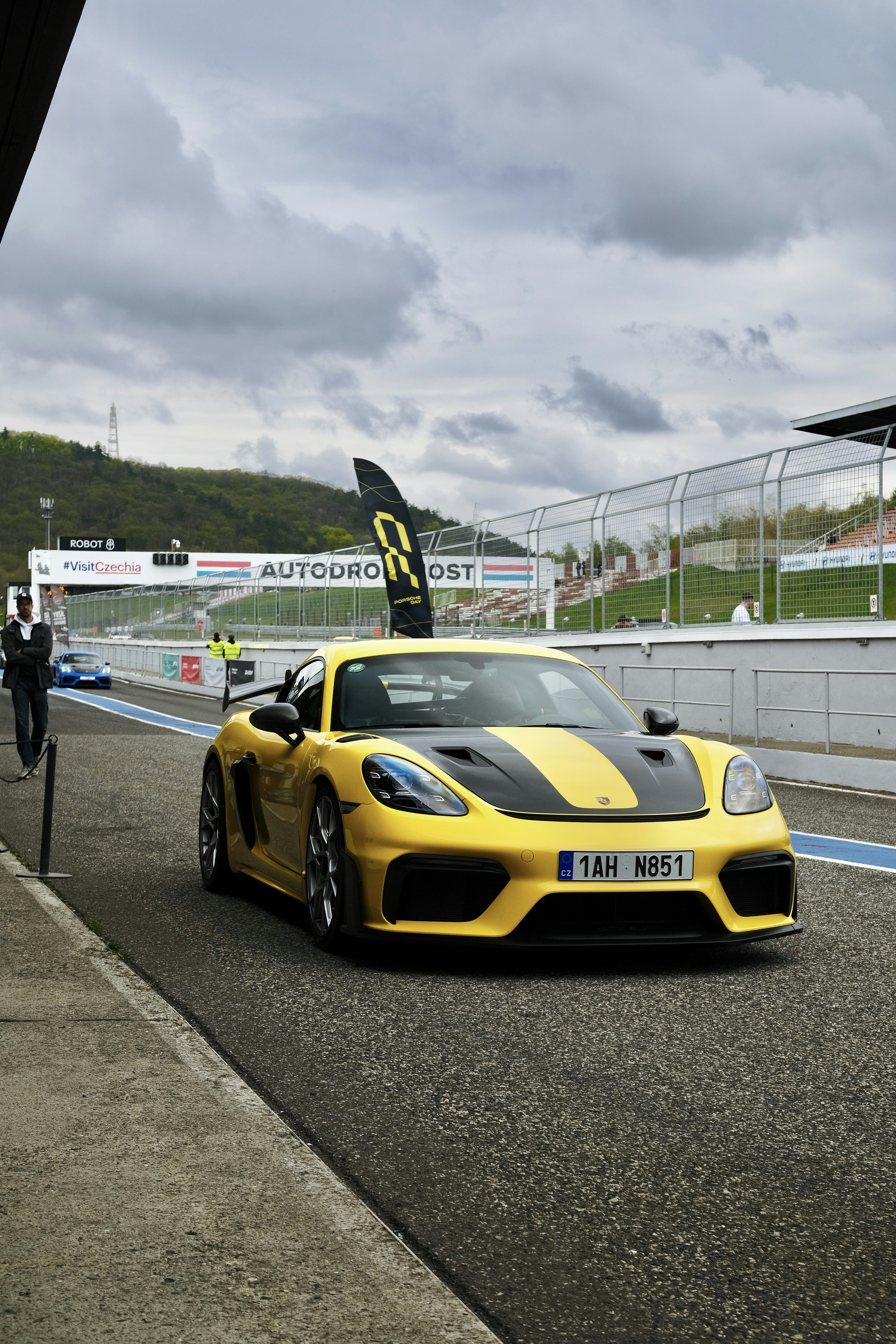 Yellow Porsche Thunder on the Circuit