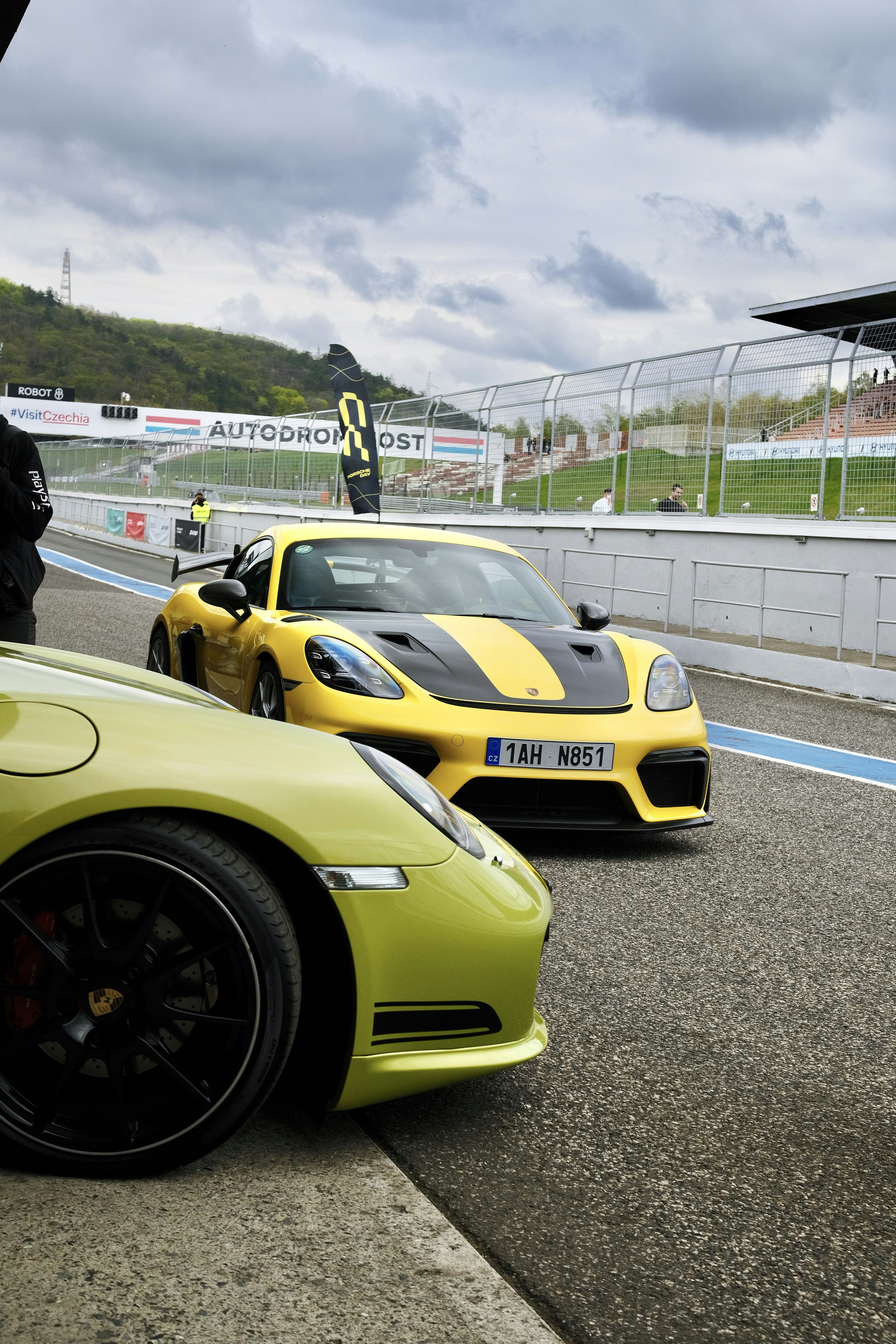 Yellow Corvette in Pit Lane: A Glimpse of Speed and Style