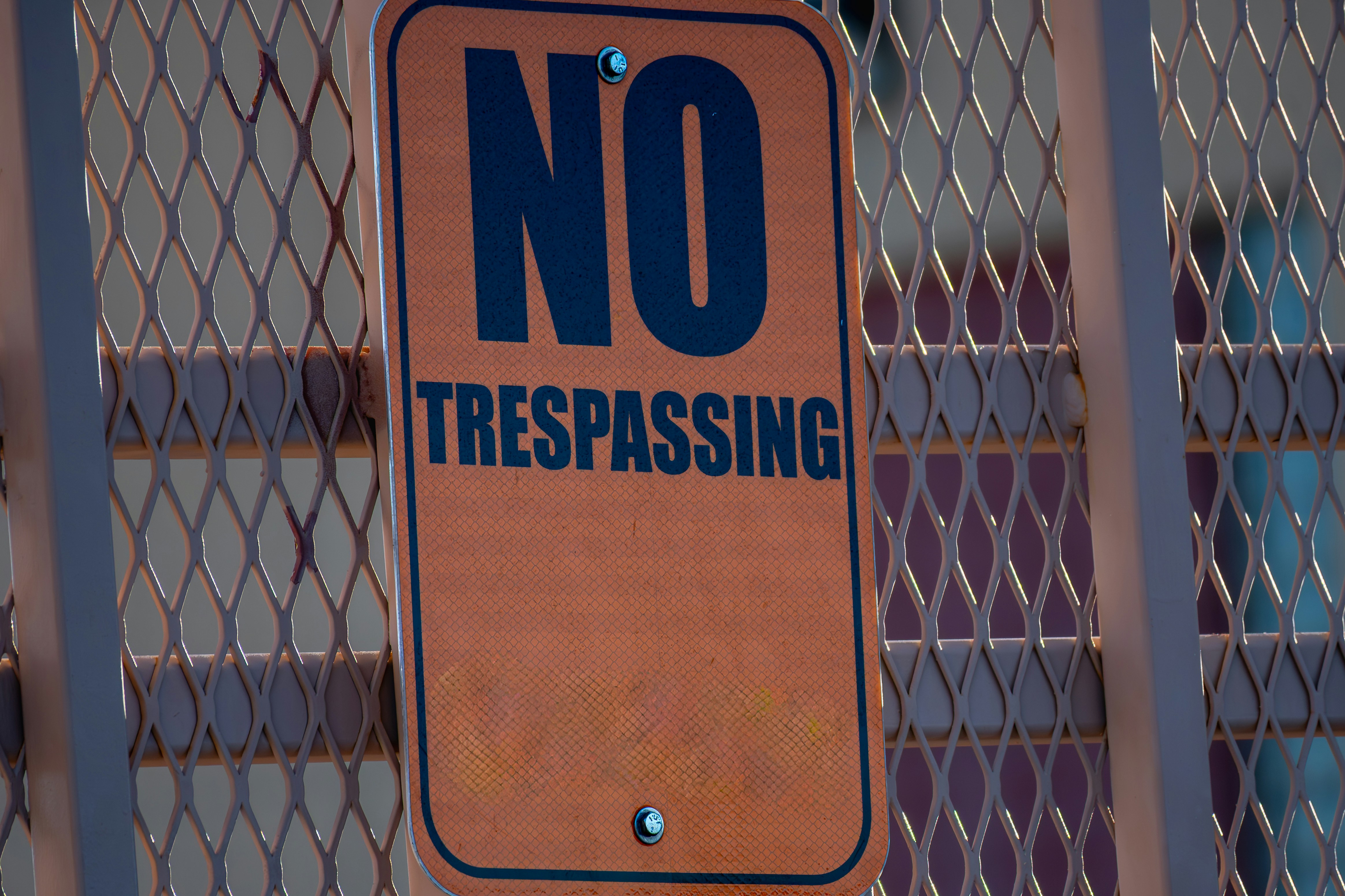 NO Trespassing: A Guarded Barrier of Metal Mesh