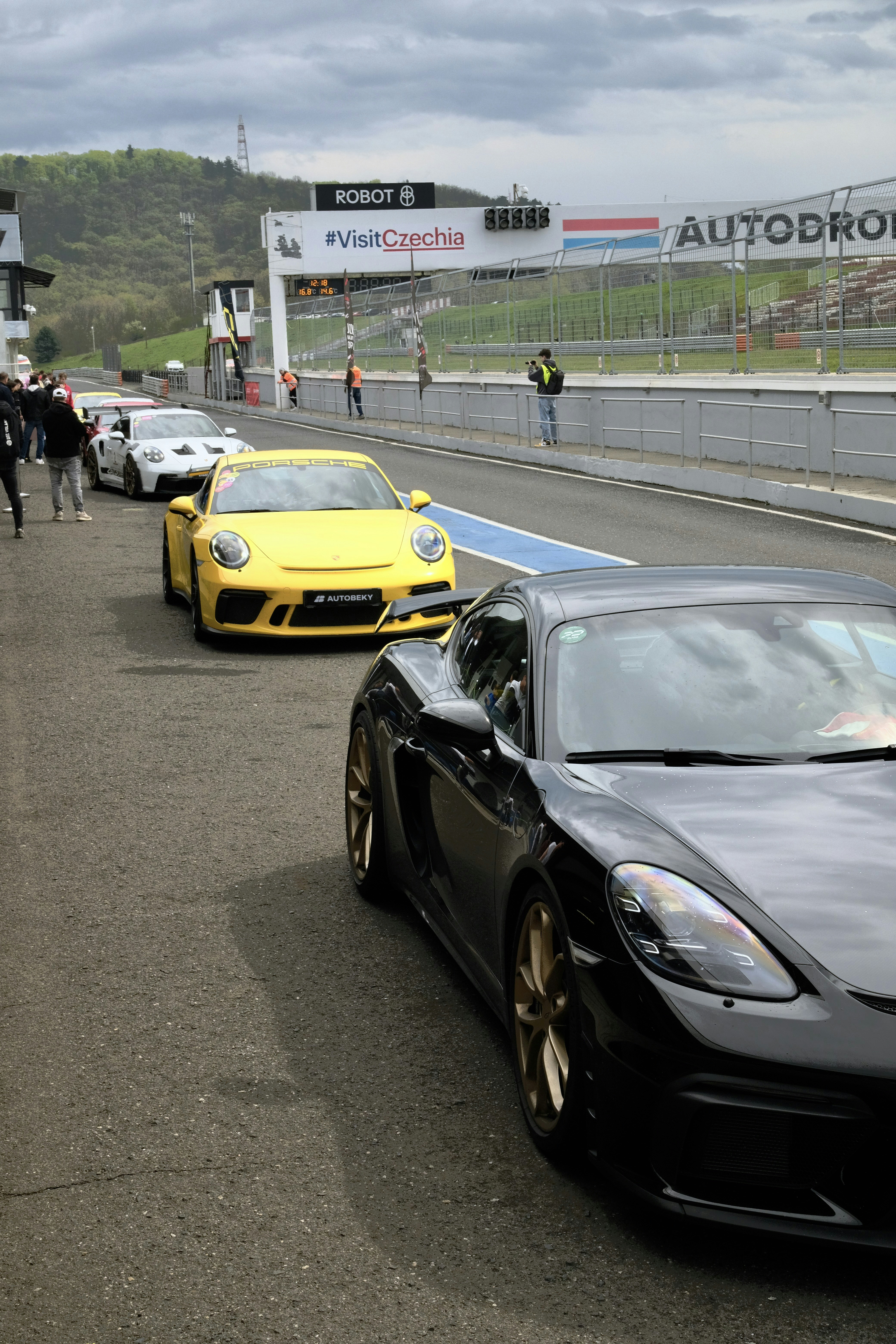 Yellow Porsche Leading the Pack at Autodrom Czech Circuit