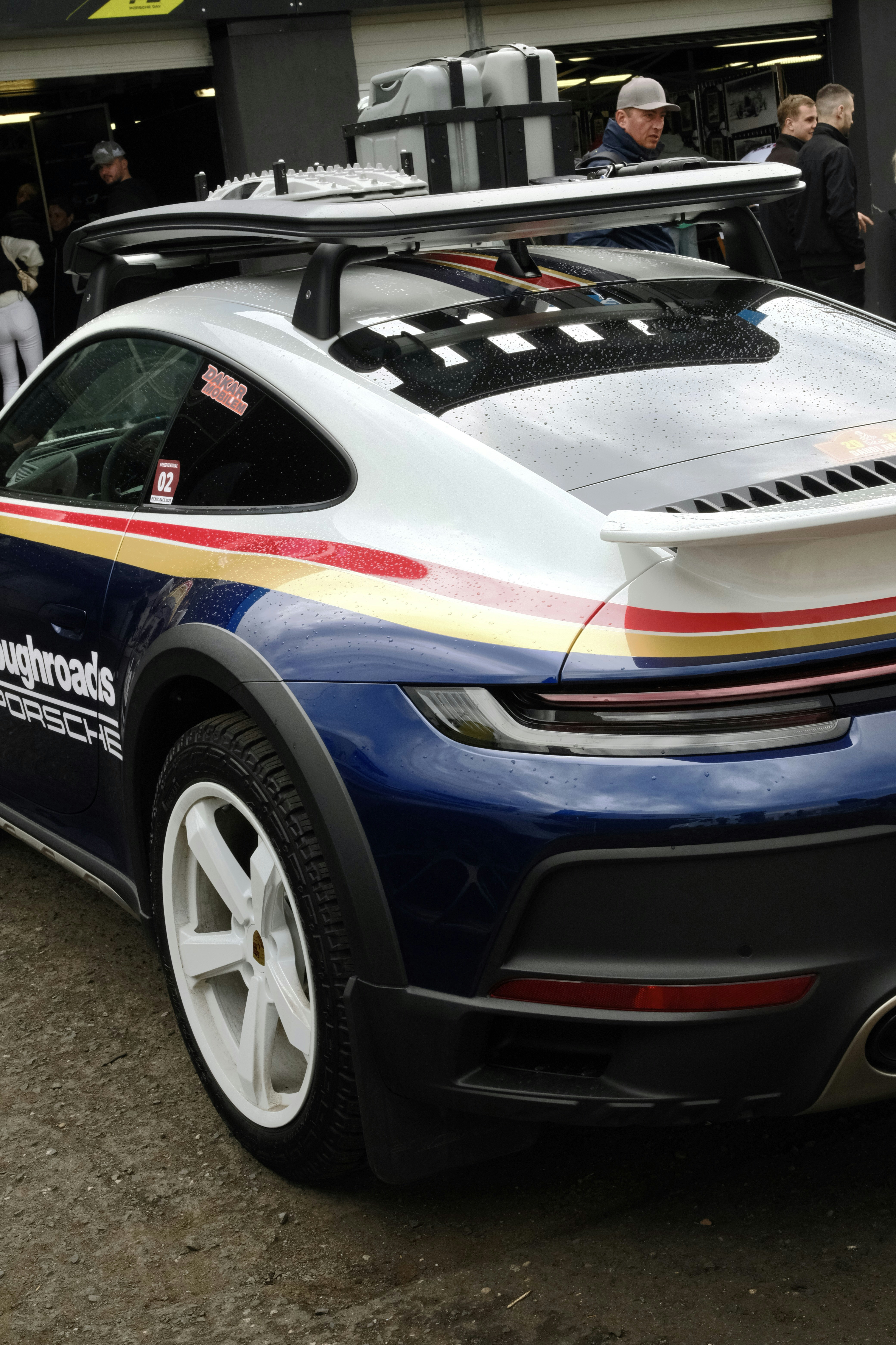 Race-Car Ritual: Porsche on a Rain-Slicked Garage Floor