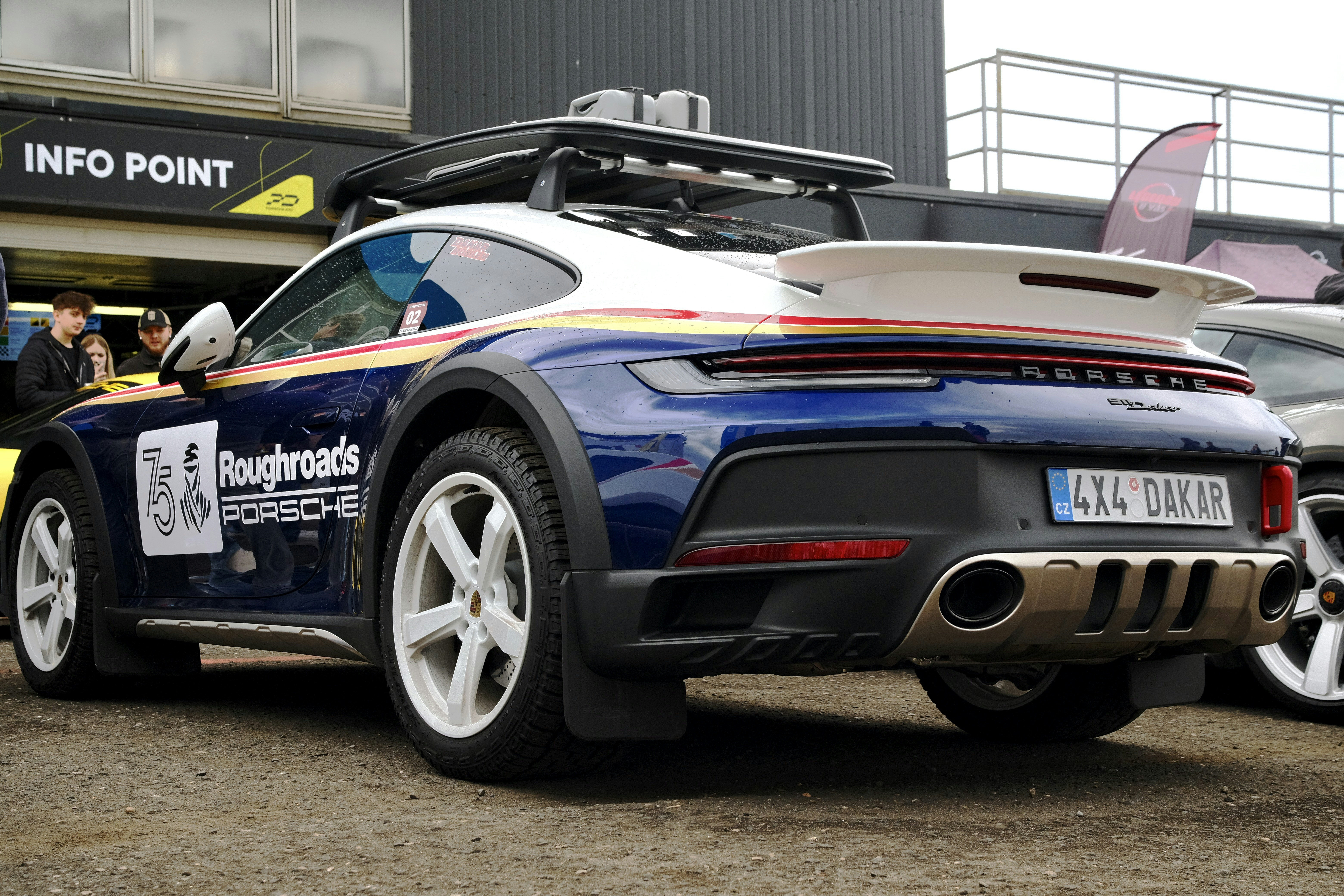 Porsche RX Patrol: A Bold Blue Car at the Info Point