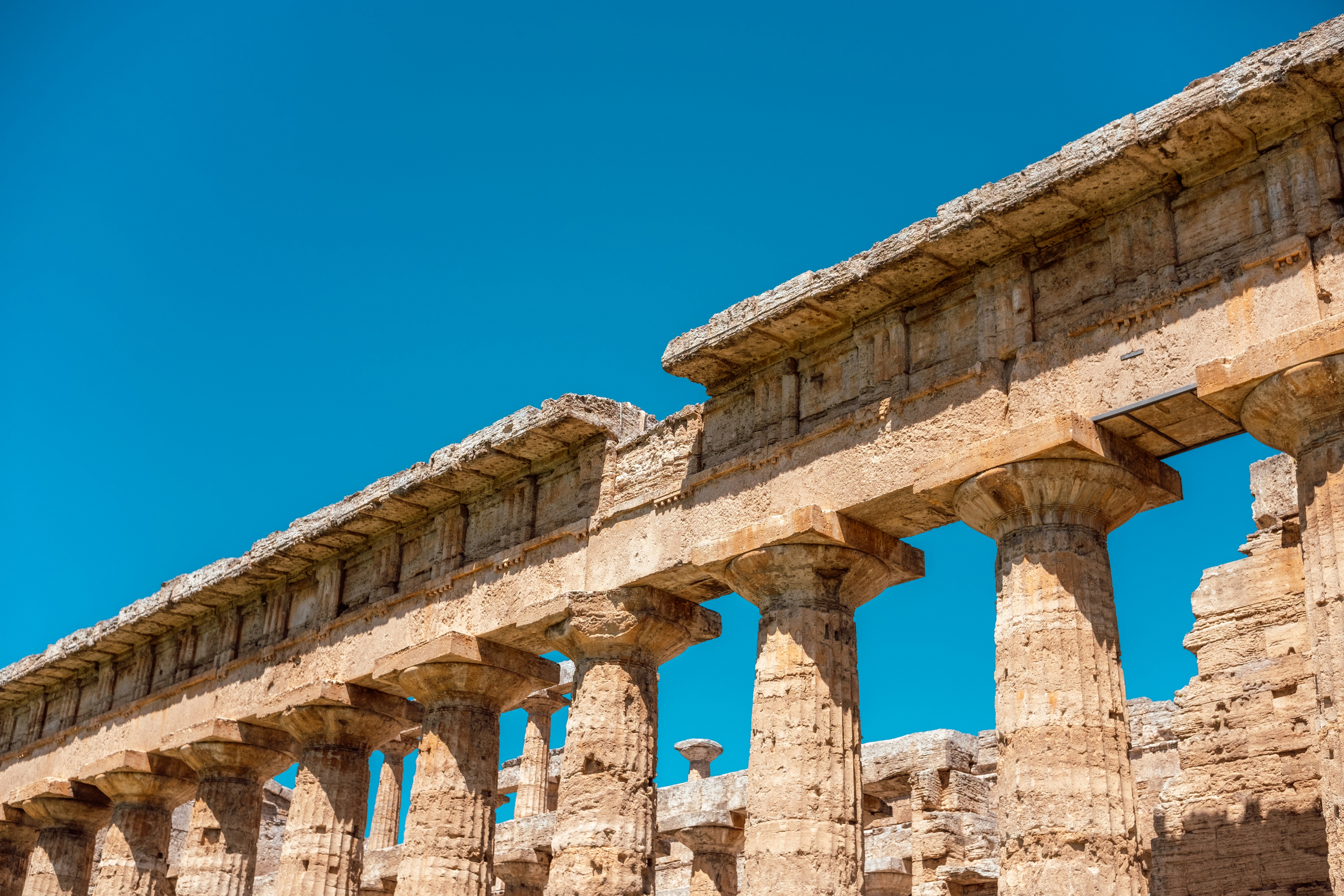 Stone Columns Against a Clear Blue Sky
