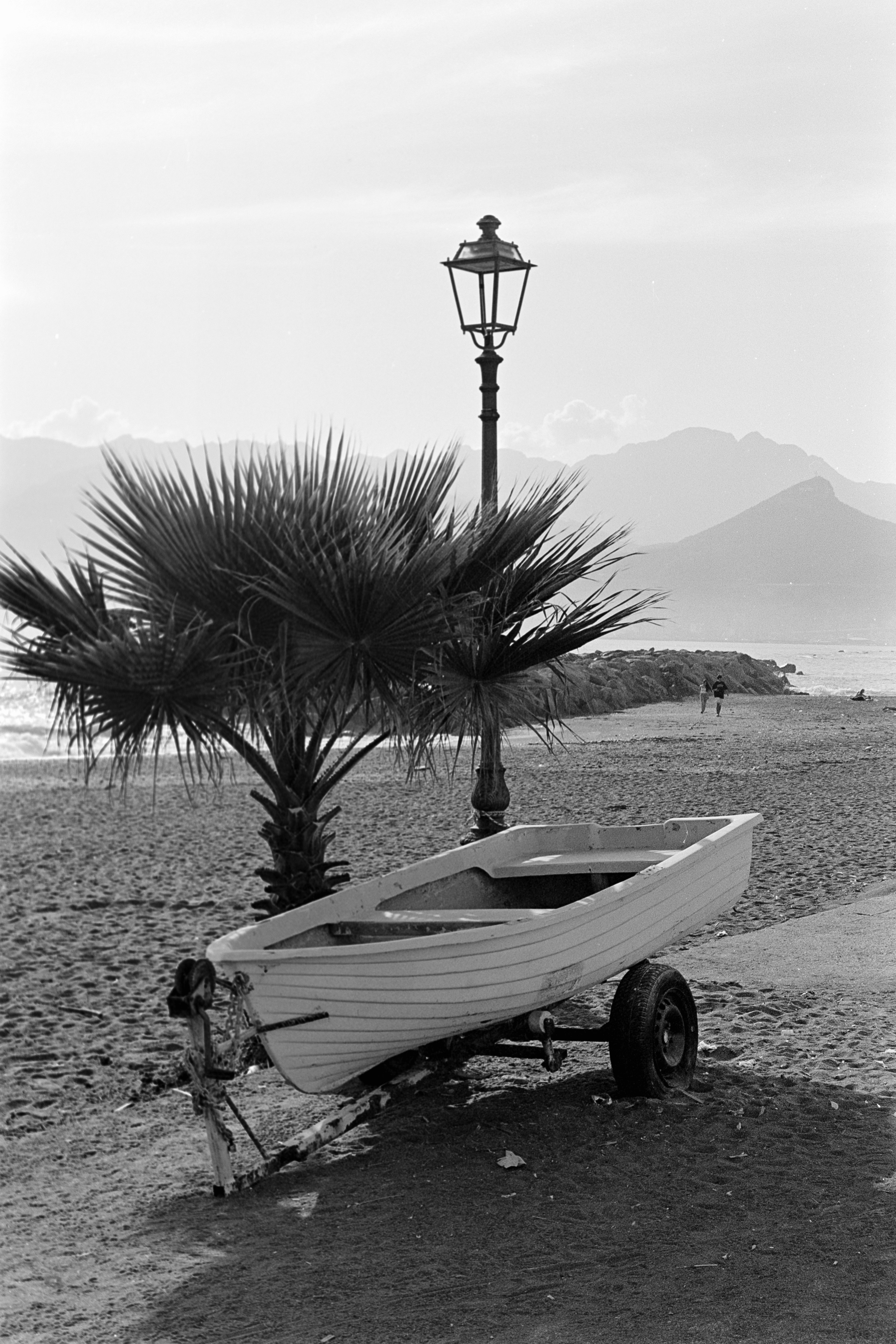 A Quiet Pier, A Boat, and a Lamp by the Shore