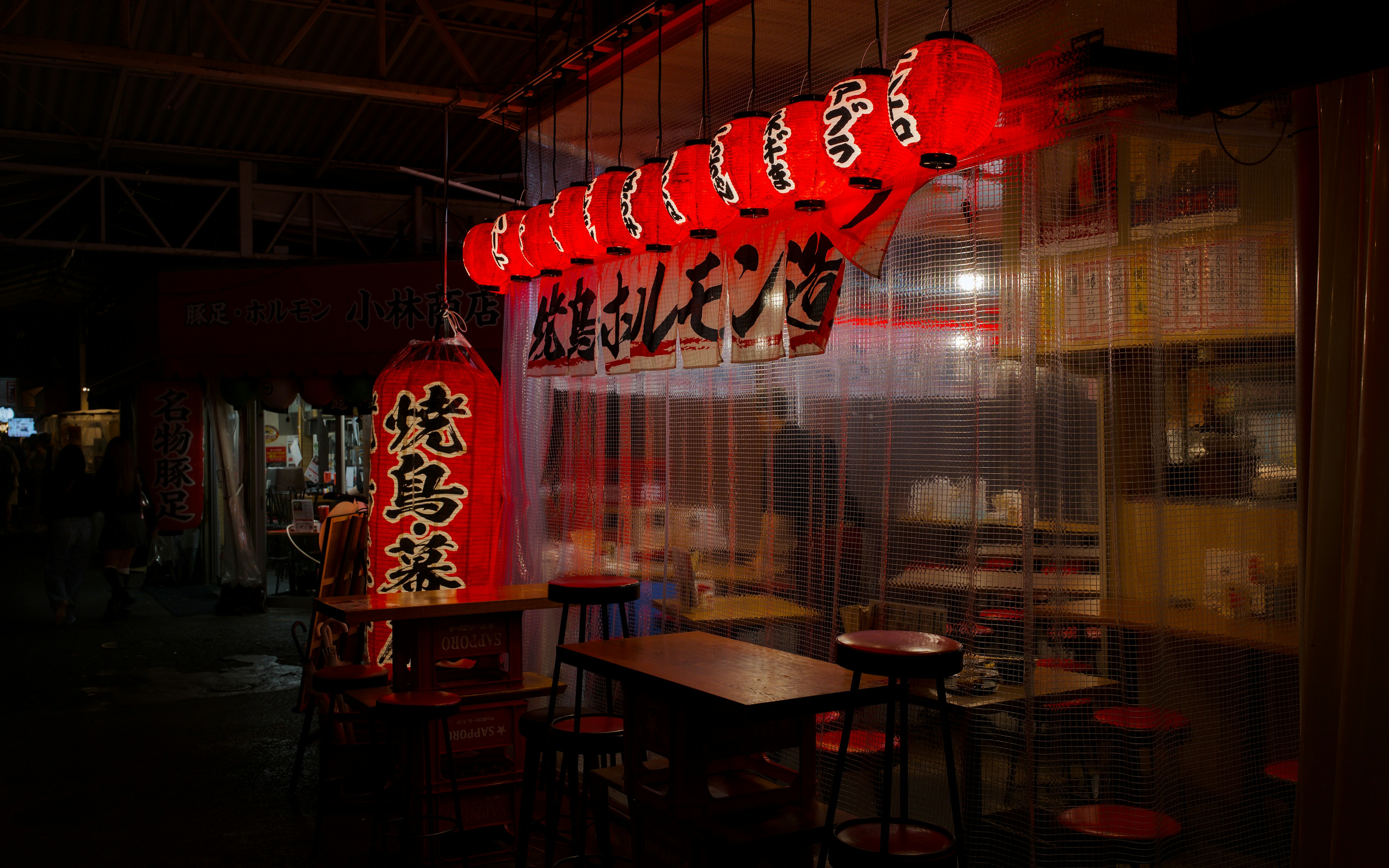 Neon Lantern Alley: Quiet Red Glow Over a Street eatery