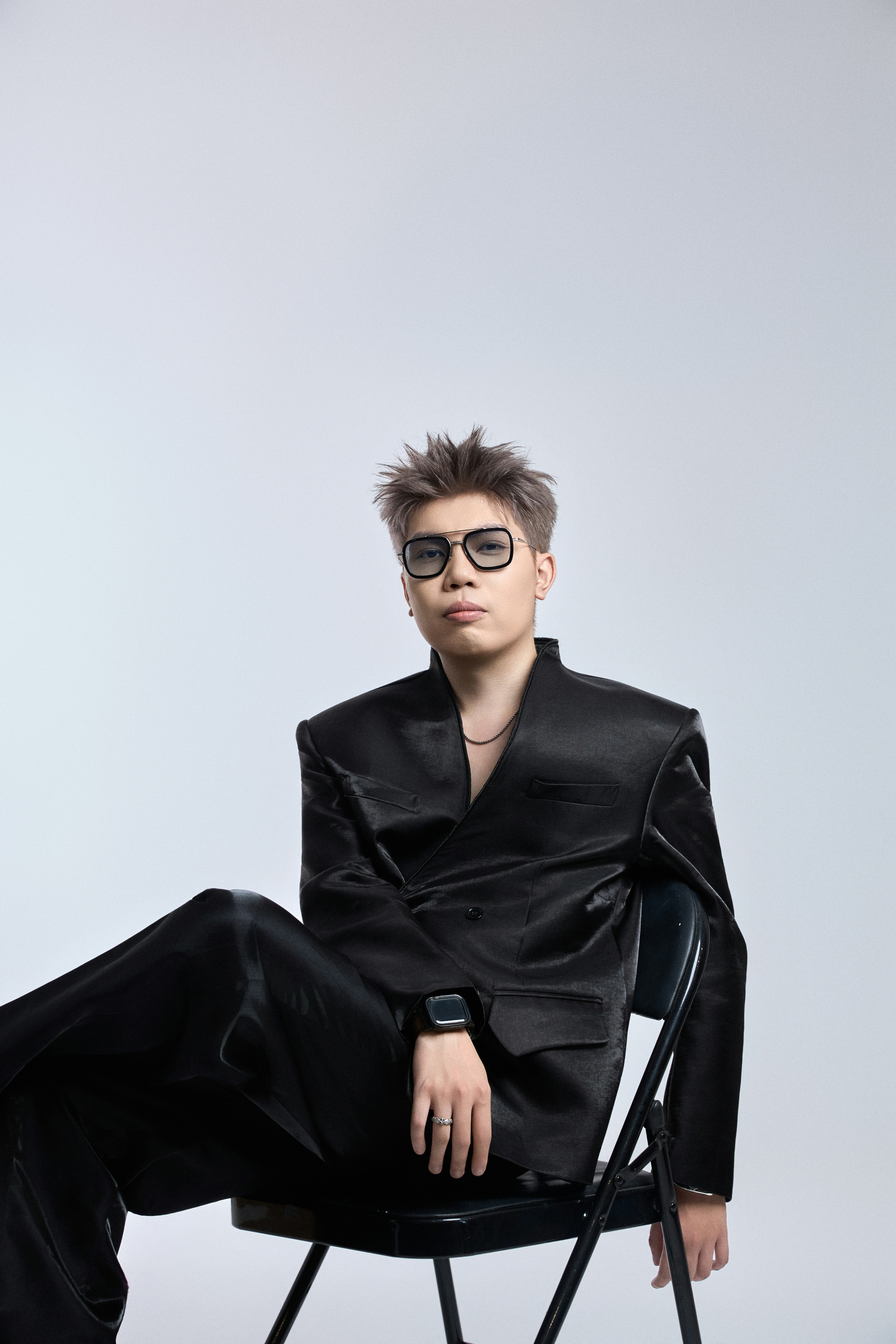 Stylish Silhouette: Confidence in a Black Satin Suit