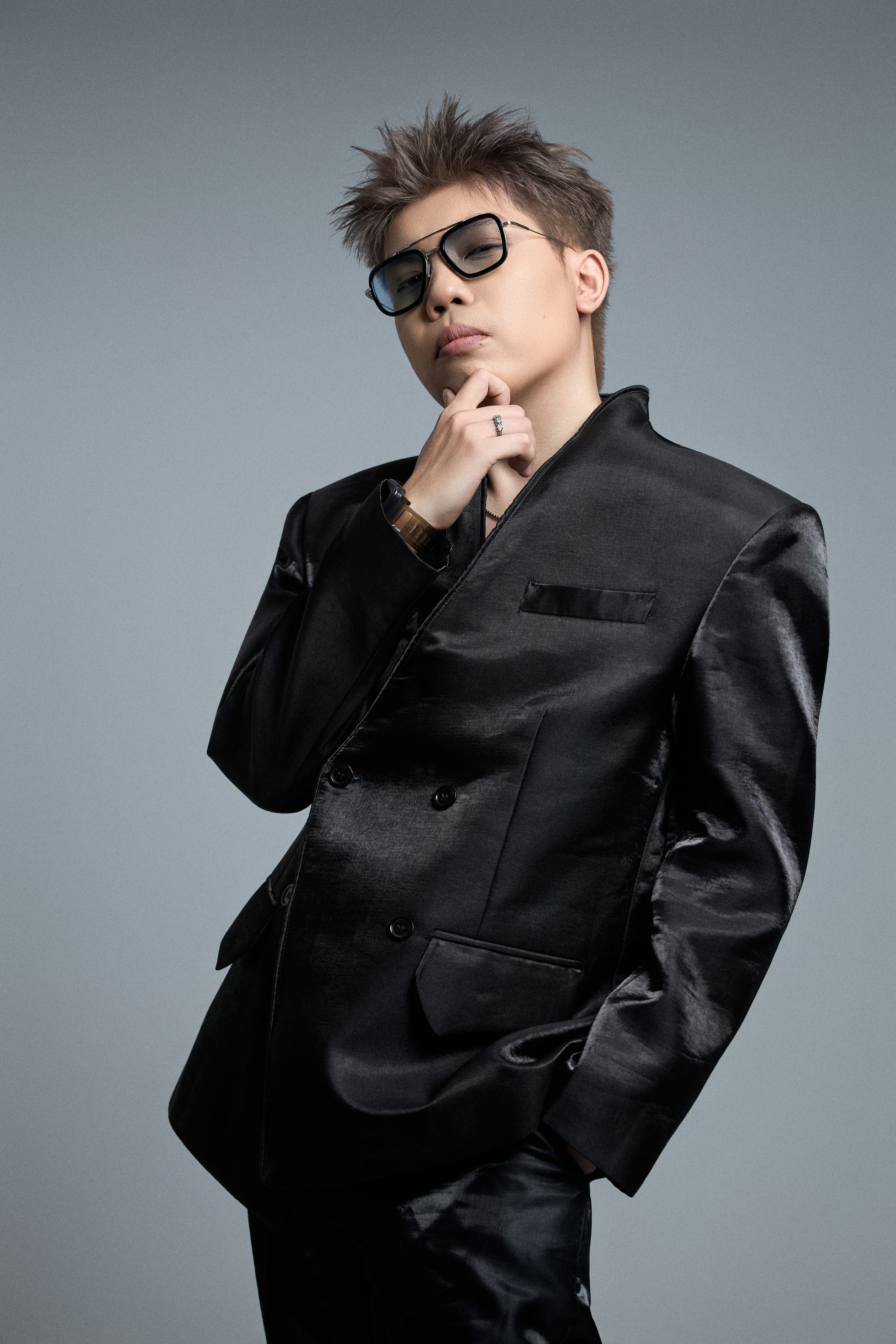 Midnight Prestige: The Confident Gaze in a Satin Suit