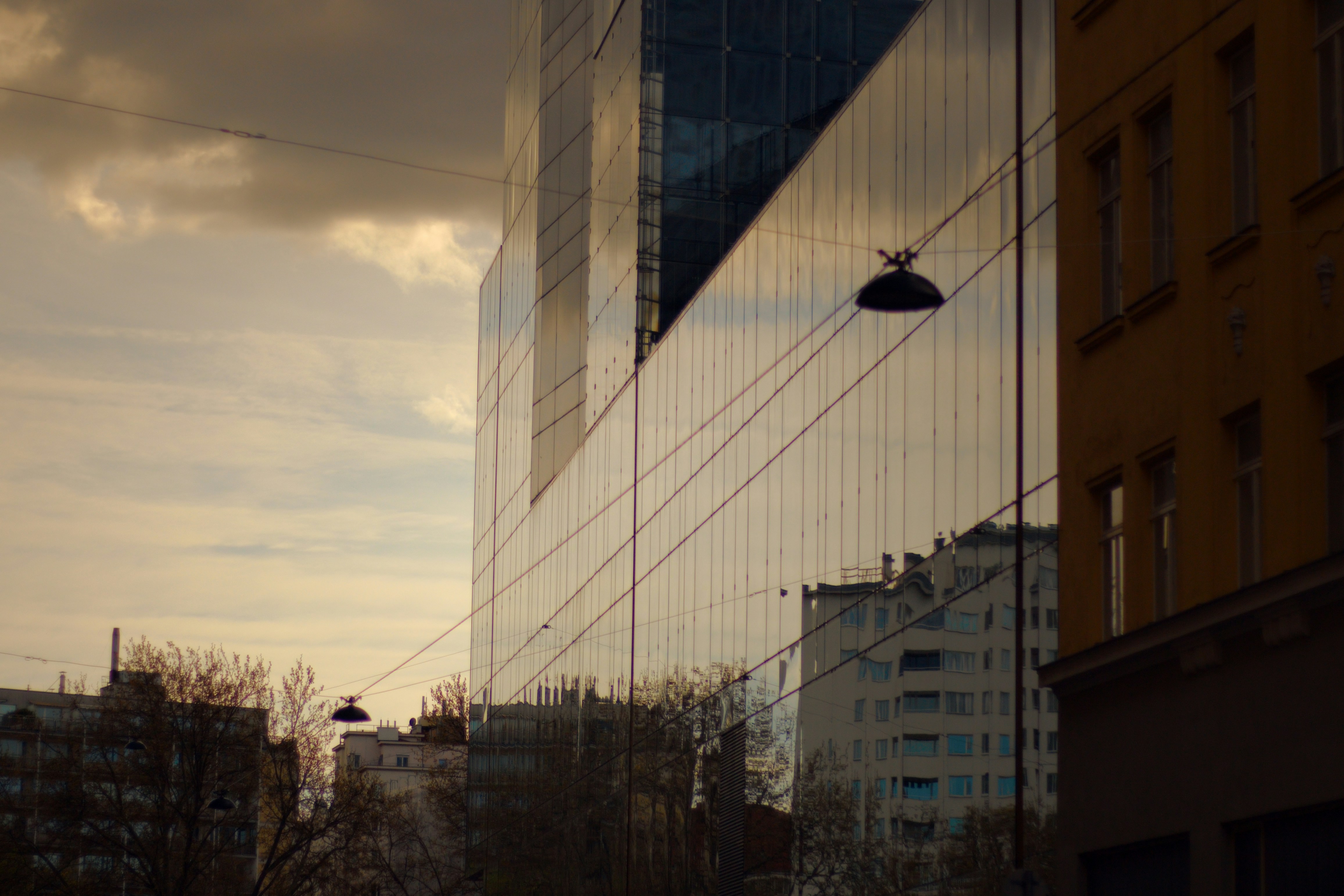Glass Veil Over an Urban Sunset