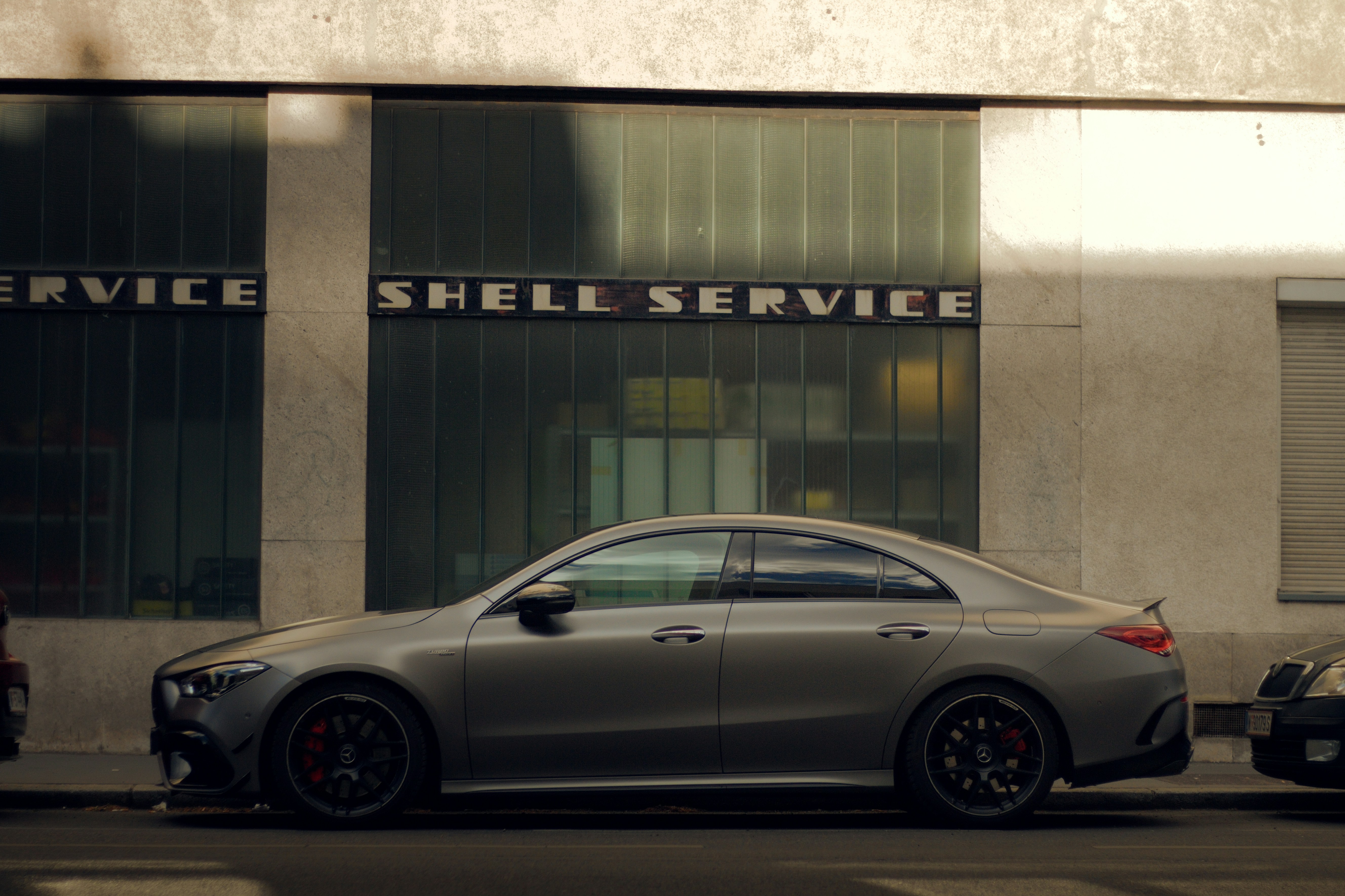 Silver Sedan Ghosting through a Streetfront Garage