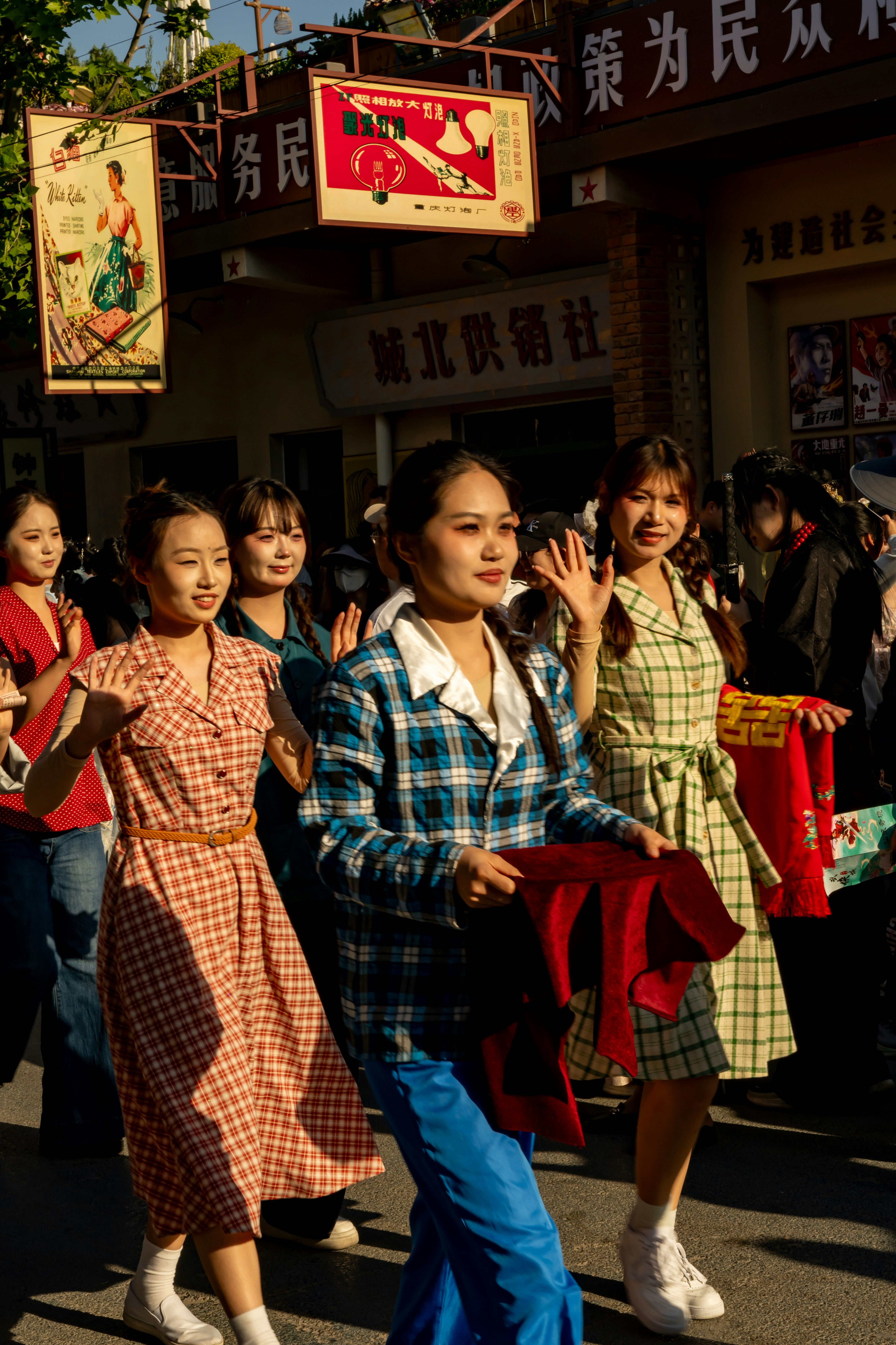 Colored Dress Parade: Central Figure Leads a Warm Street Moment