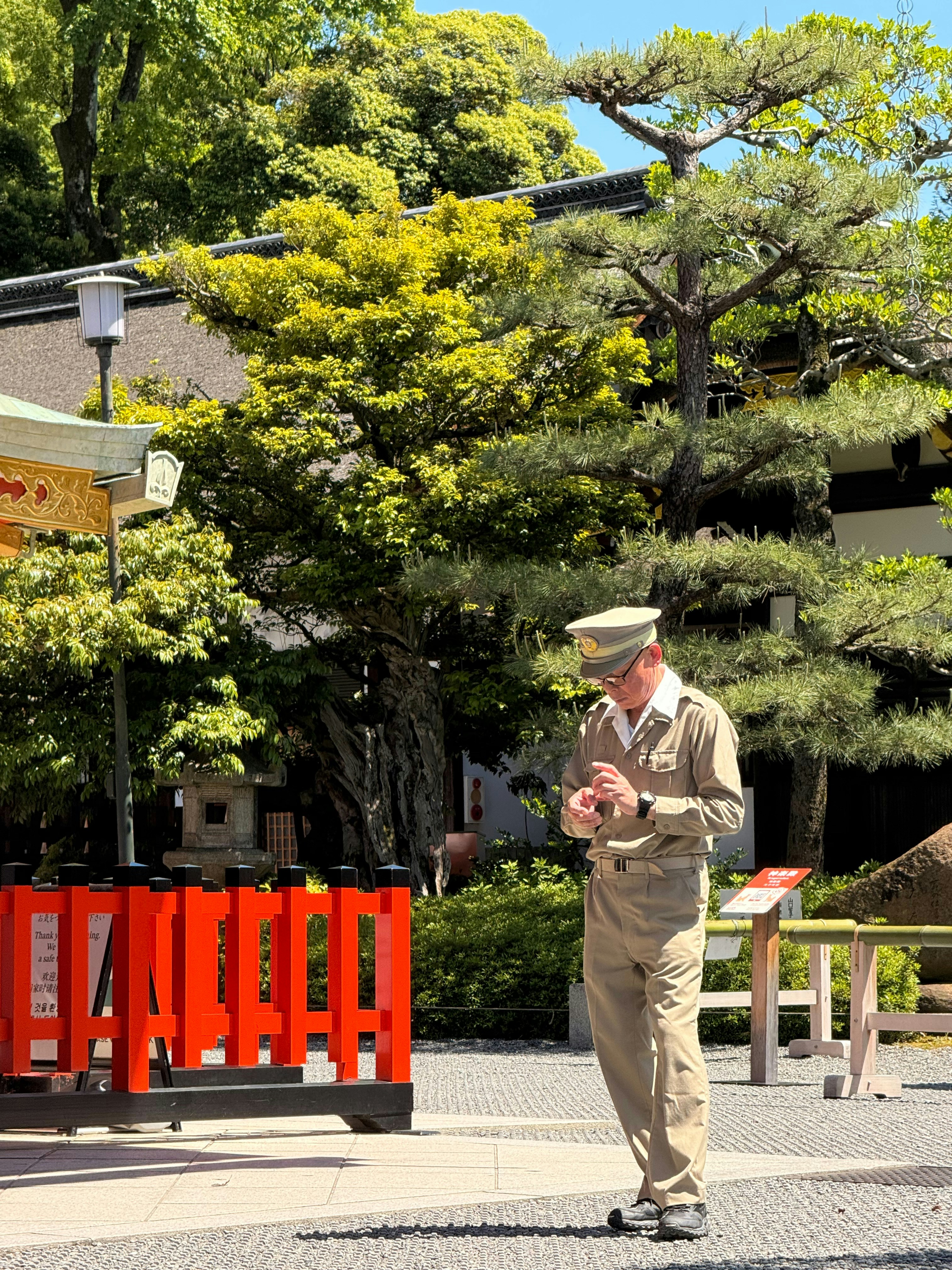 Gentleman in Khaki Amid Japanese Temple Grounds