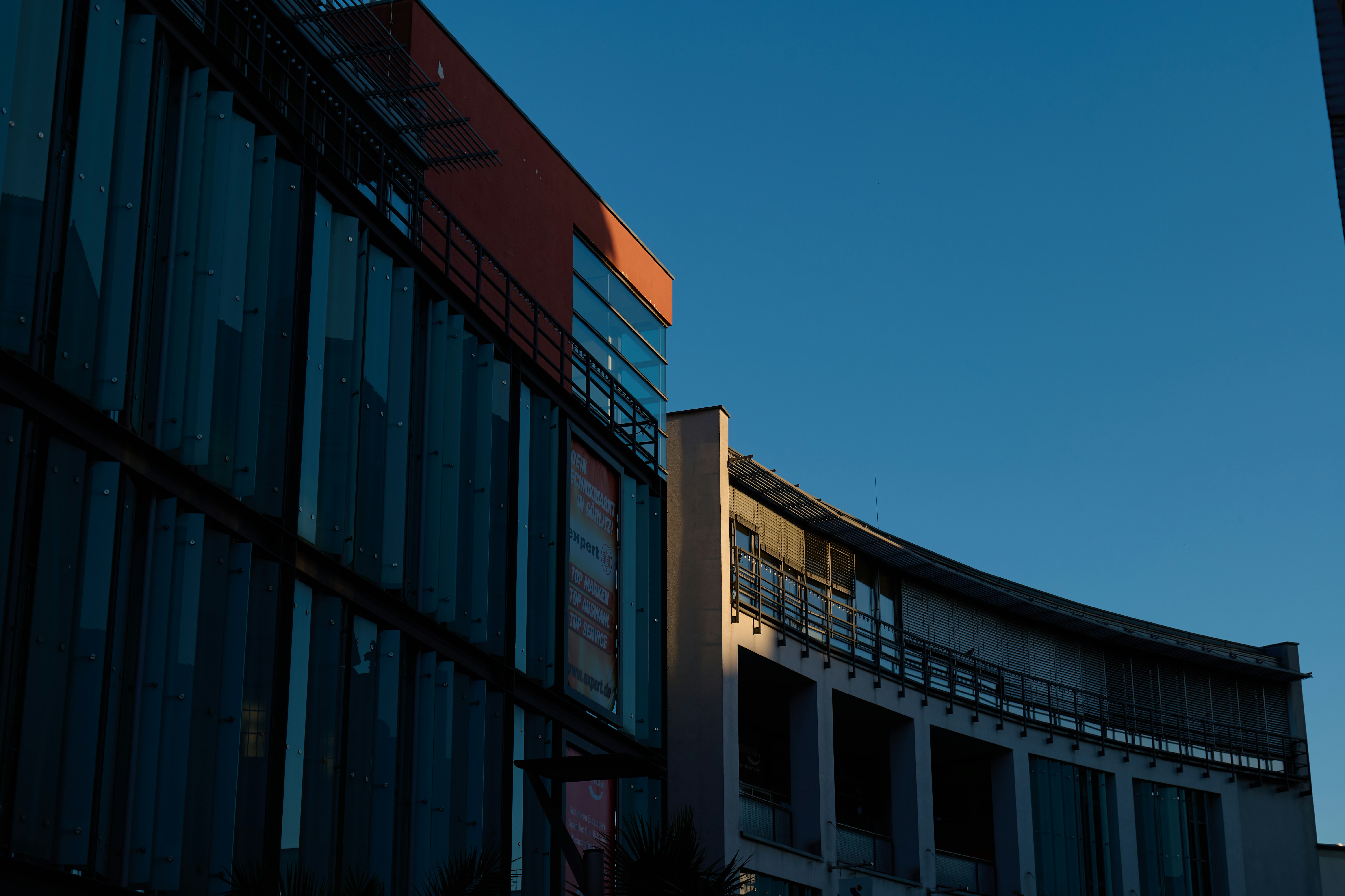 Edge of Light: Urban Facades Under a Clear Blue Sky