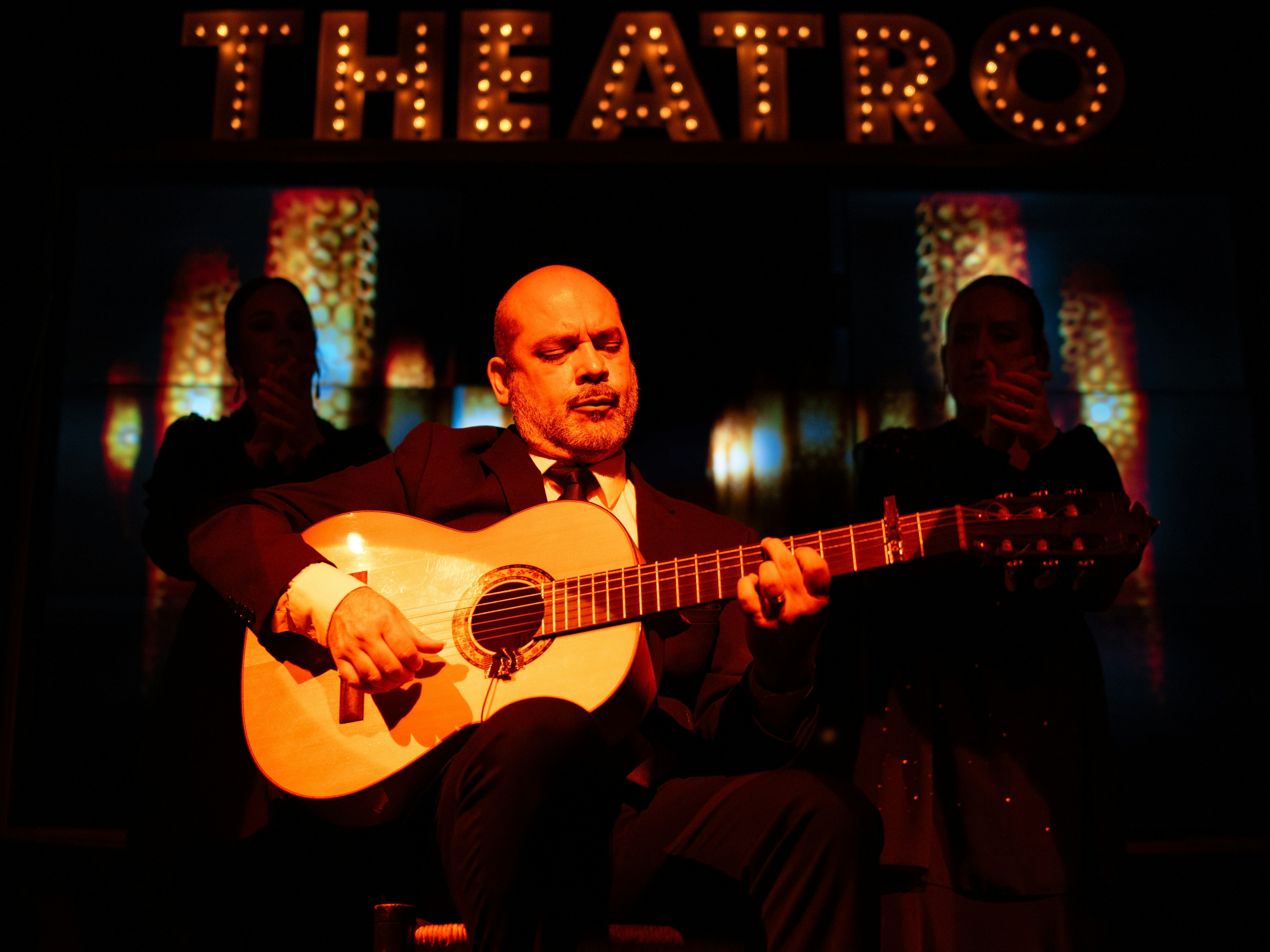 Guitarist in Warm Theater Spotlight