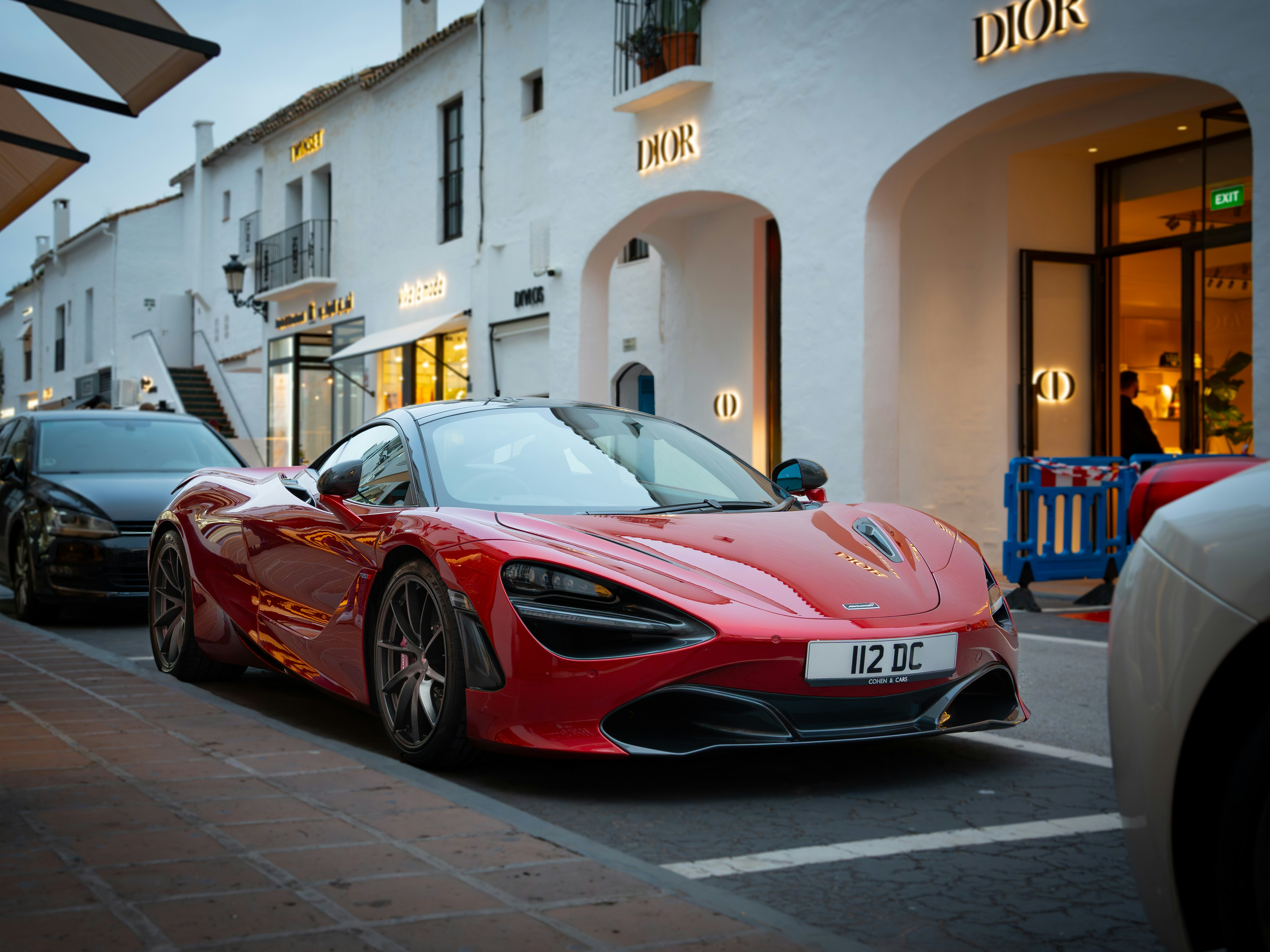 Red Ferrari on a Mediterranean Street