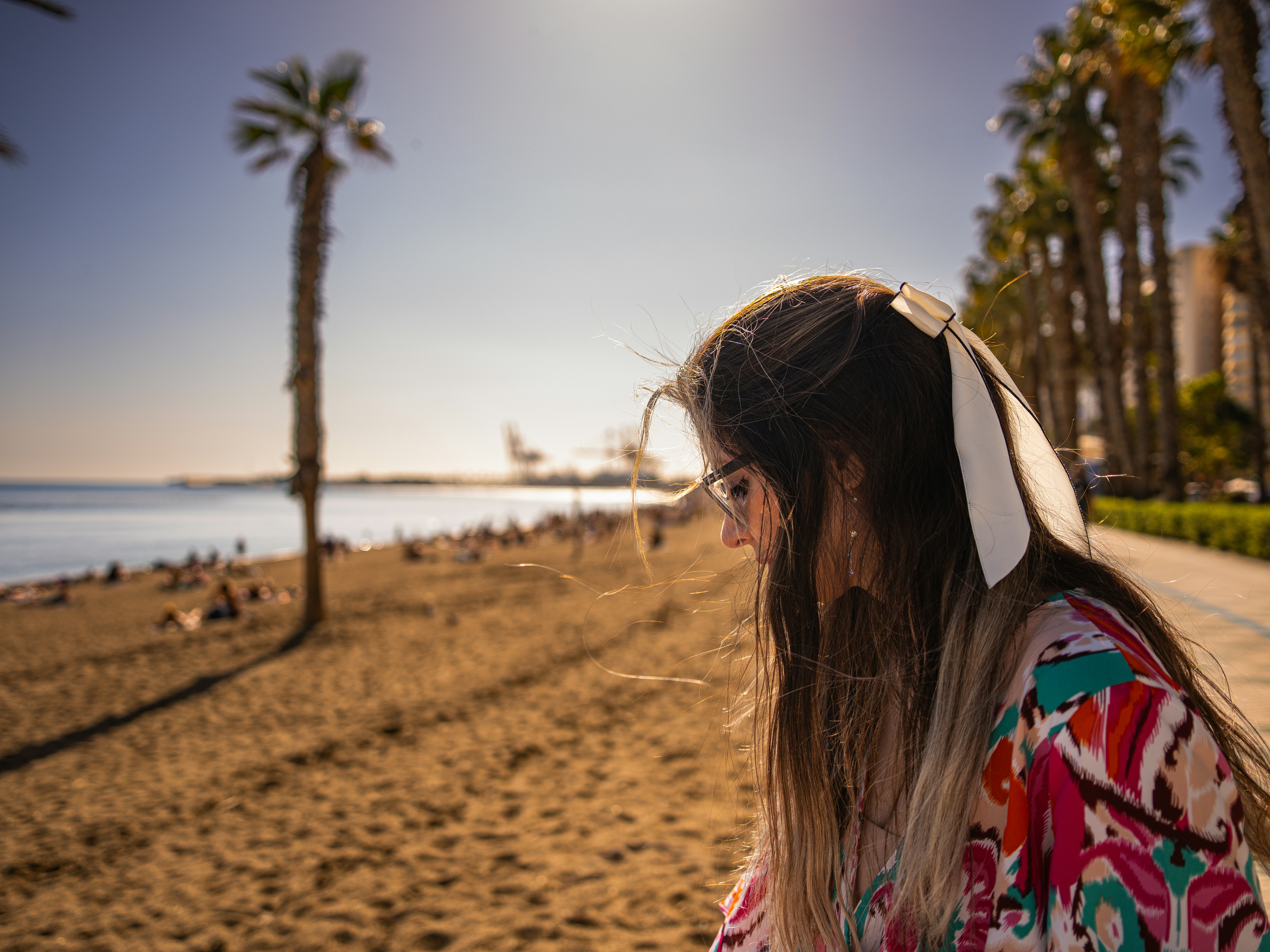 Sunlit Harbor: Portrait at the Palm-Lined Beach