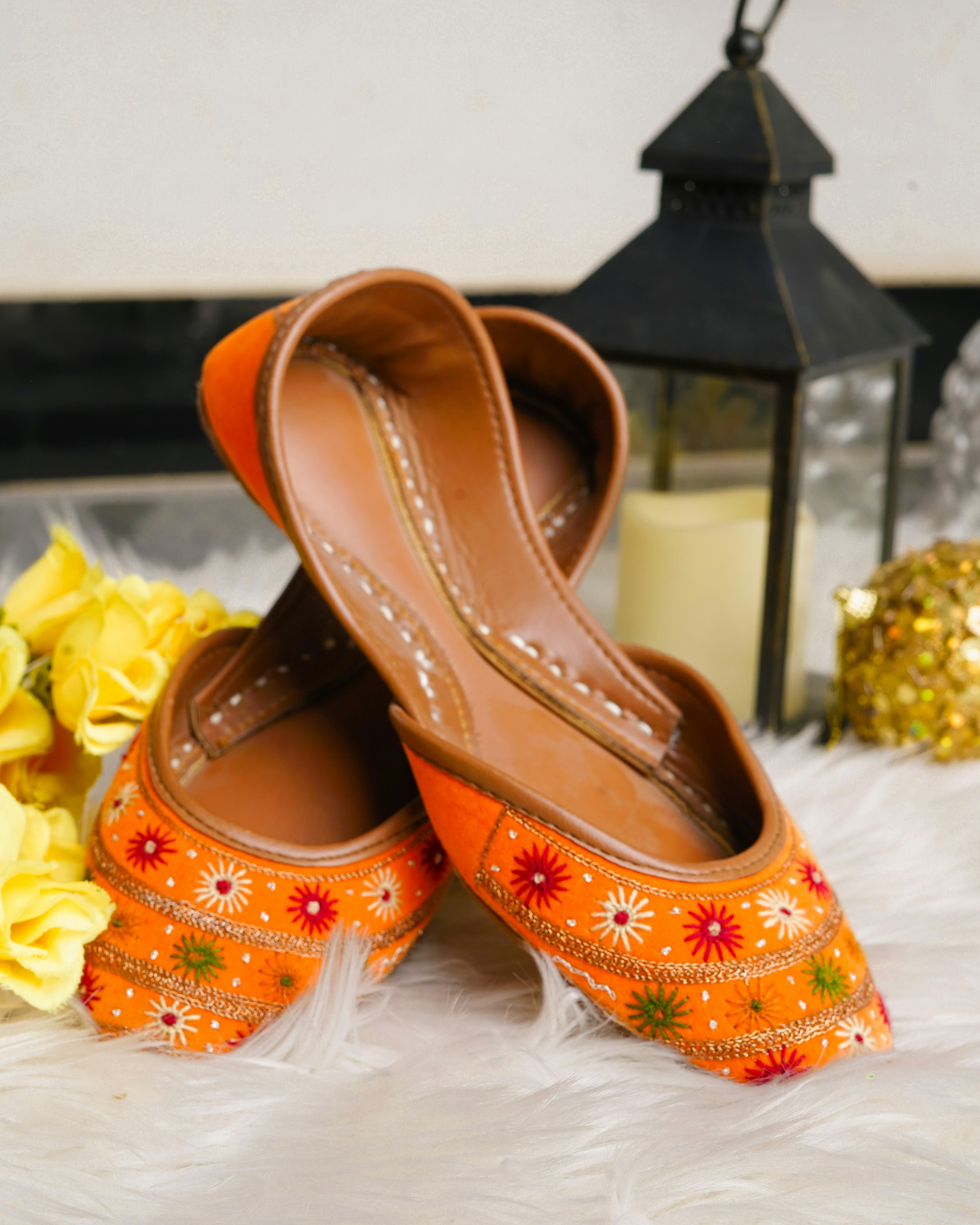 Bright Embroidered Slippers Rest on Soft White Fur